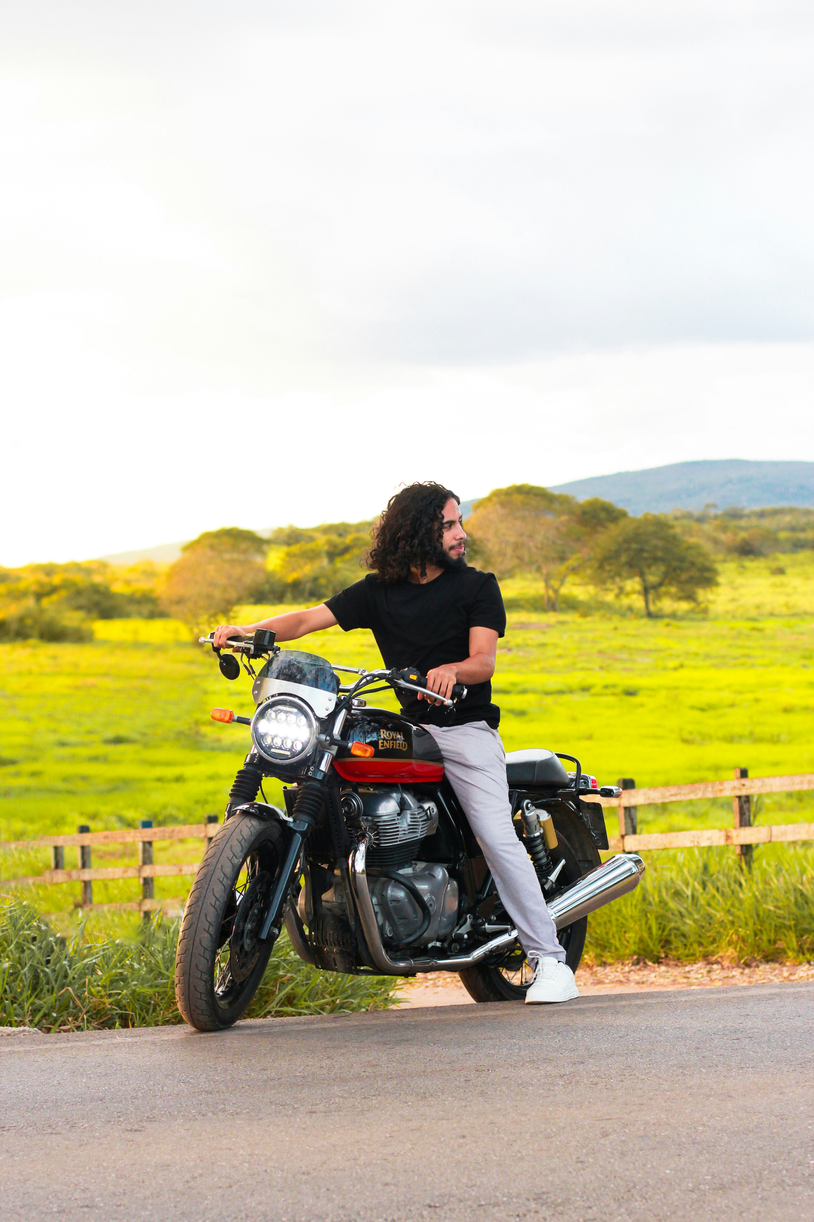 Rider on the Rustic Road: A Moment of Steel and Sunset