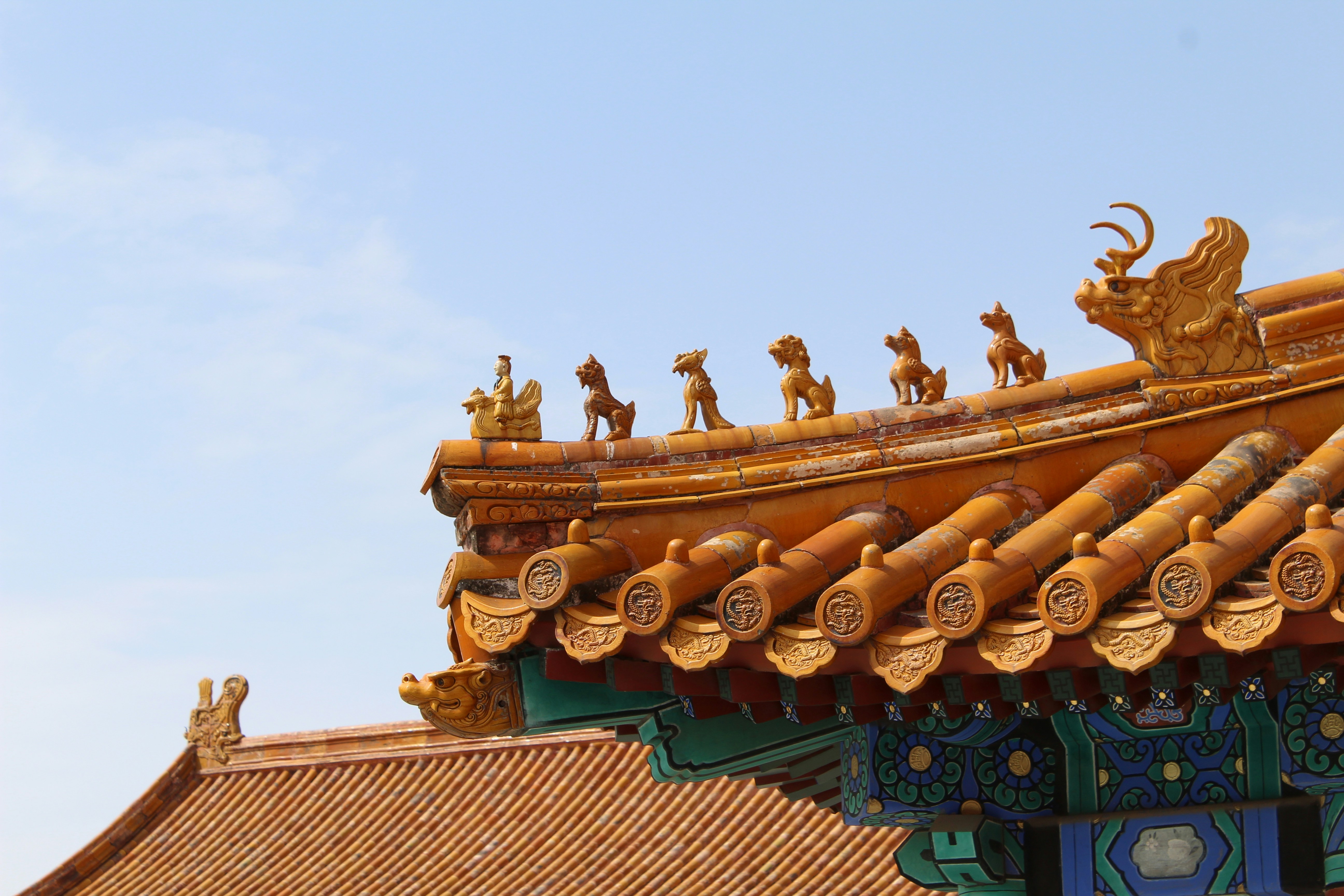 Mysterious Animals on the Palace Roofs of the Forbidden City；There are more or less rows of small animal statues on the roofs of each palace in the Forbidden City. They are mythical creatures in ancient Chinese legends, which represent all kinds of magic and wonderful things. Generally speaking, there are 3, 5, 7, or 9 animal statues on the roofs, and the order is also fixed, by Dragon, Phoenix, Lion, Sea Horse, Heavenly Steed, Suan Ni, Ya Yu, Xie Zhi, Dou Niu. The more animal statues, the higher palace rank.