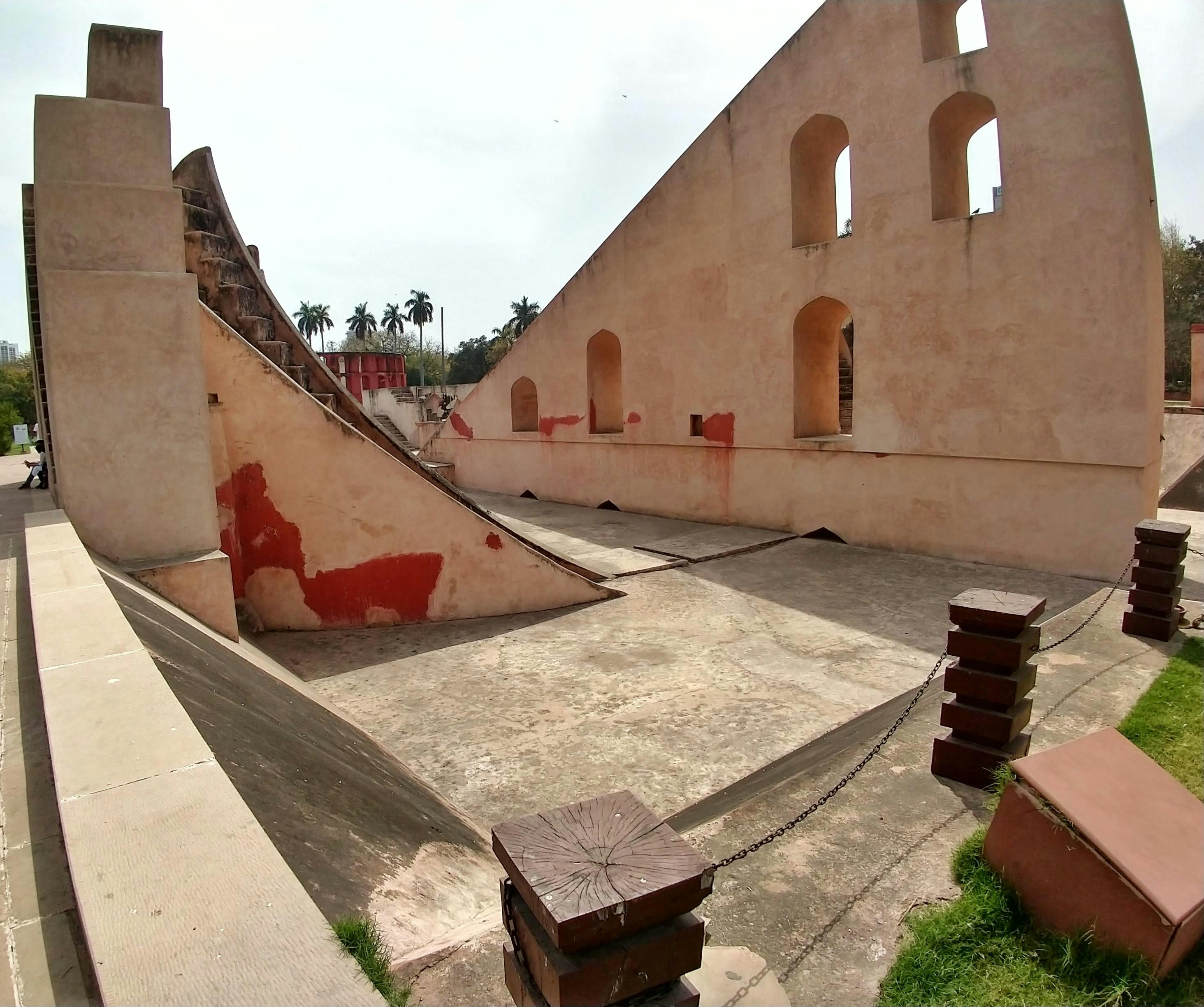 A skateboard park with a ramp and benches