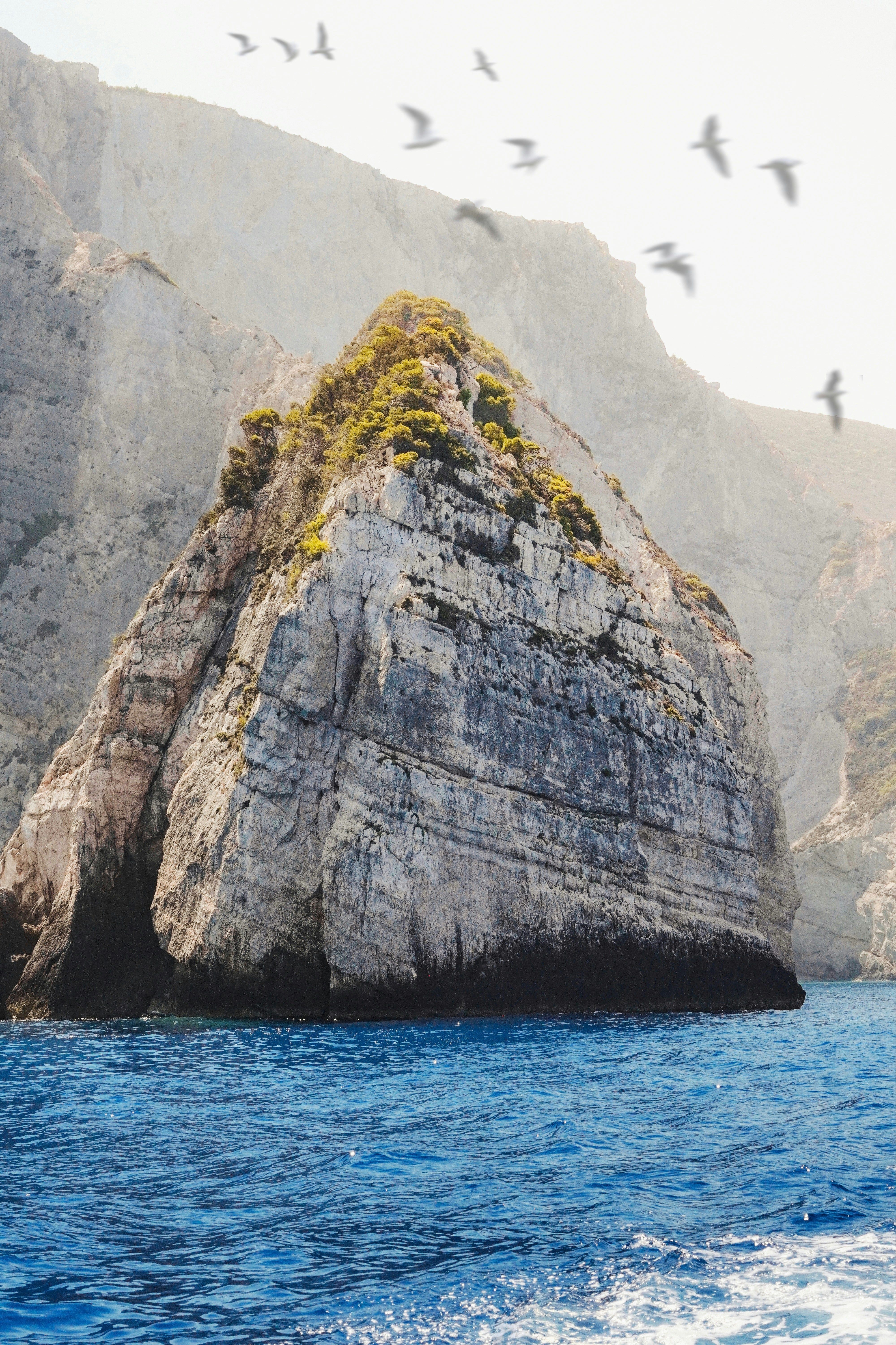 Seabird Promontory: A Lone Rock Framed by Turquoise Waves