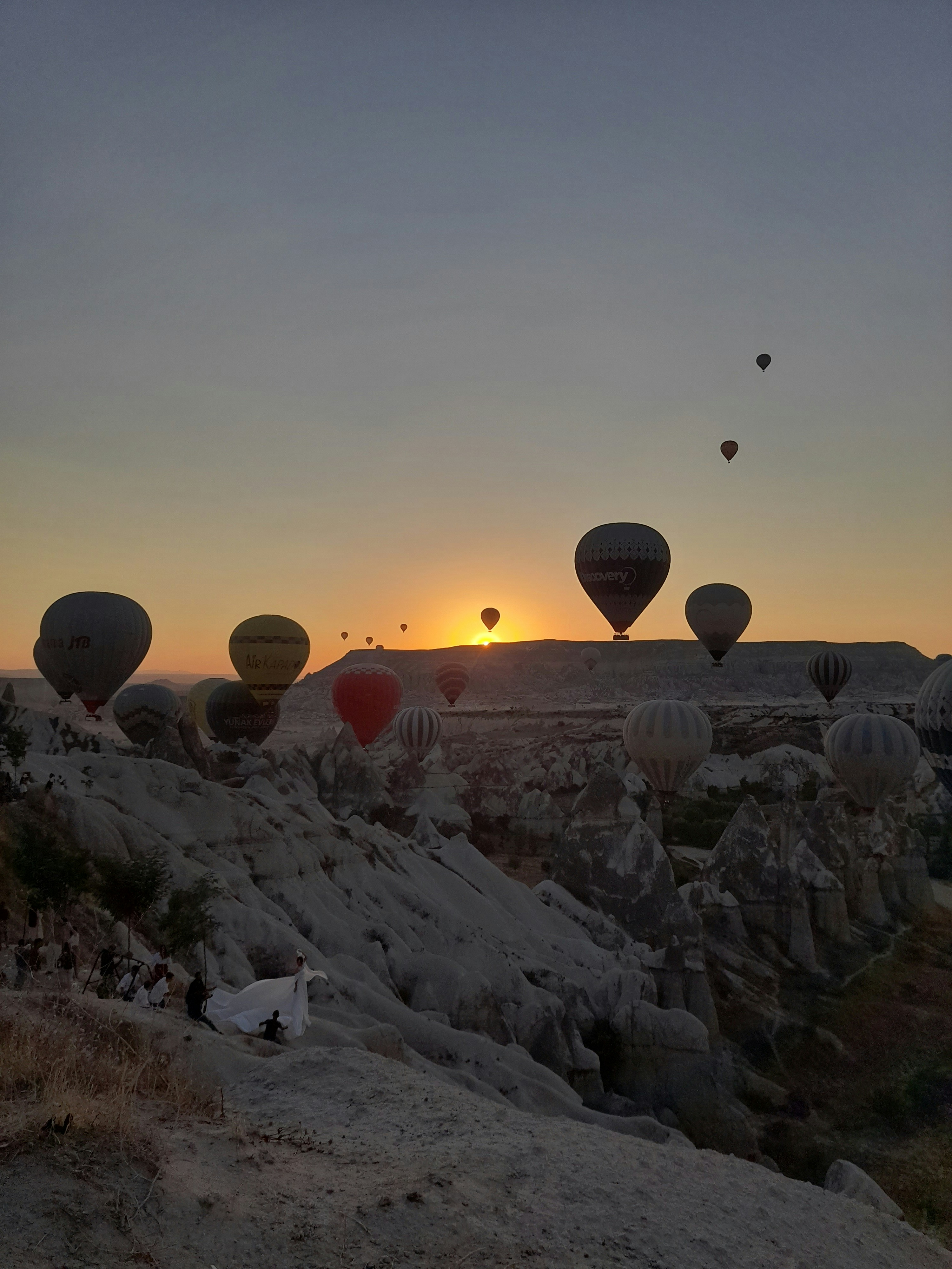 A group of hot air balloons flying in the sky photo – Free Human Image ...