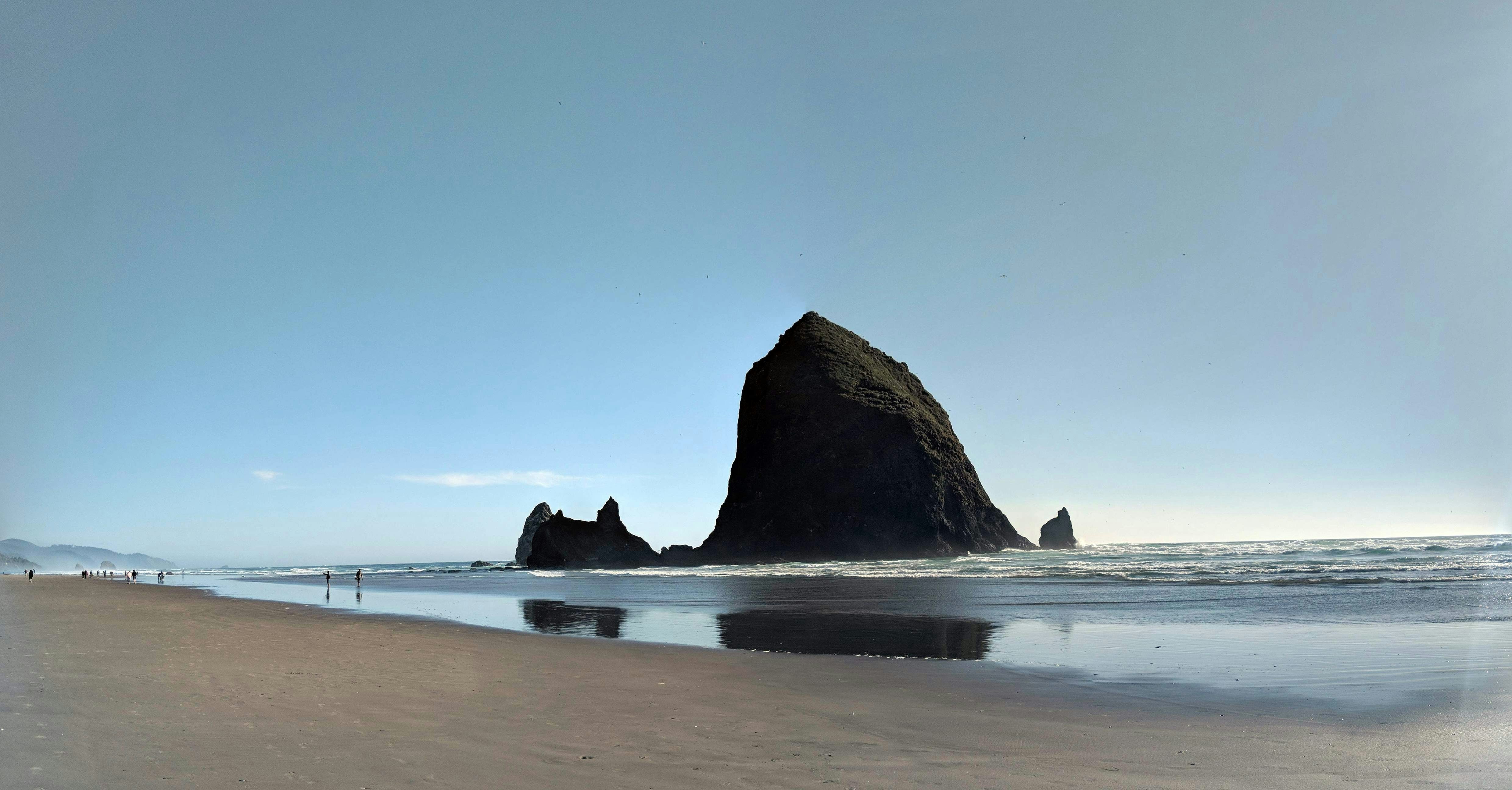Sea Stack Sentinel: A Lone Rock Emerges from Calm Tide