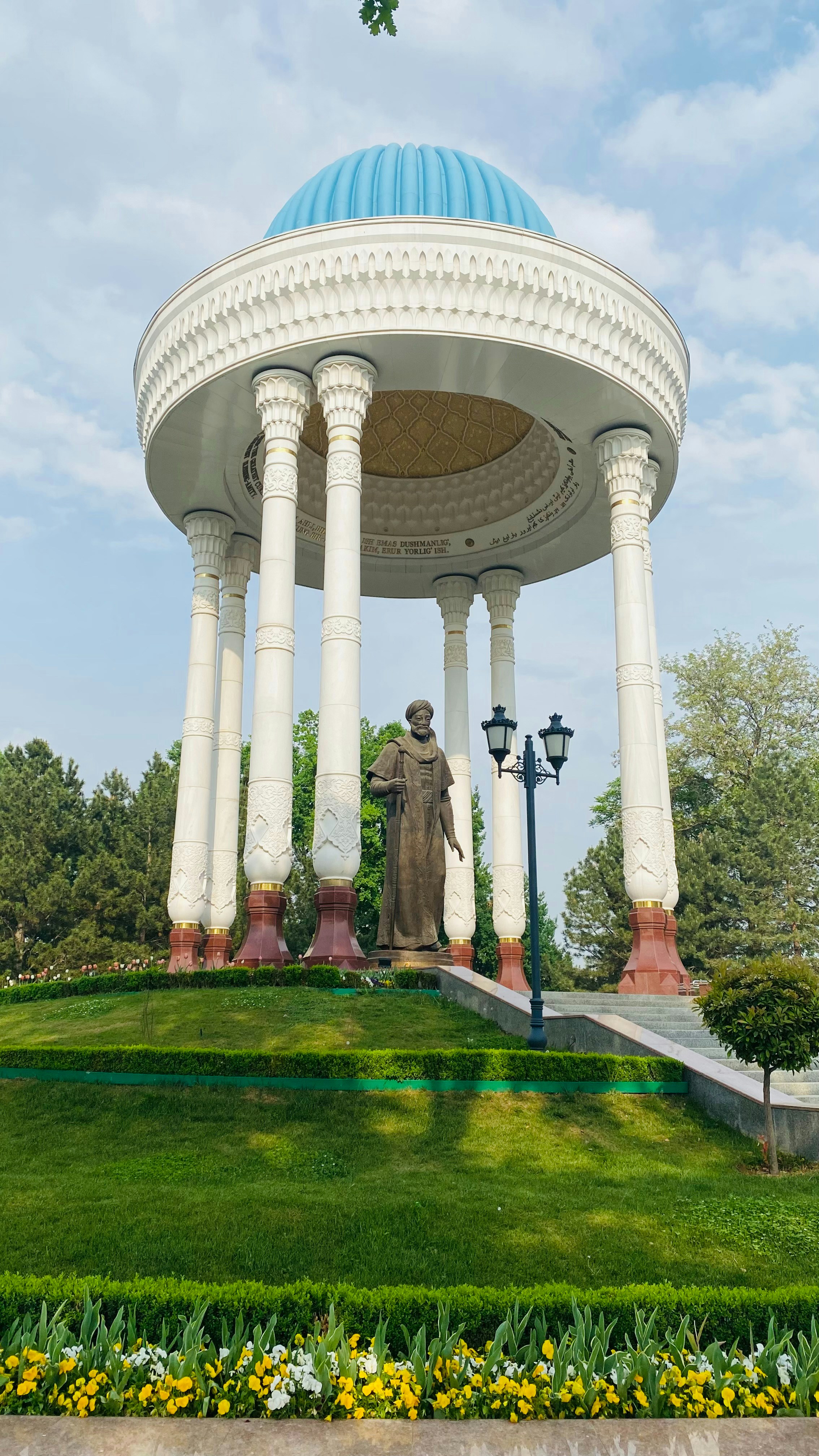 Azure Dome Over Marble Columns: A Quiet Monument in Spring Gardens