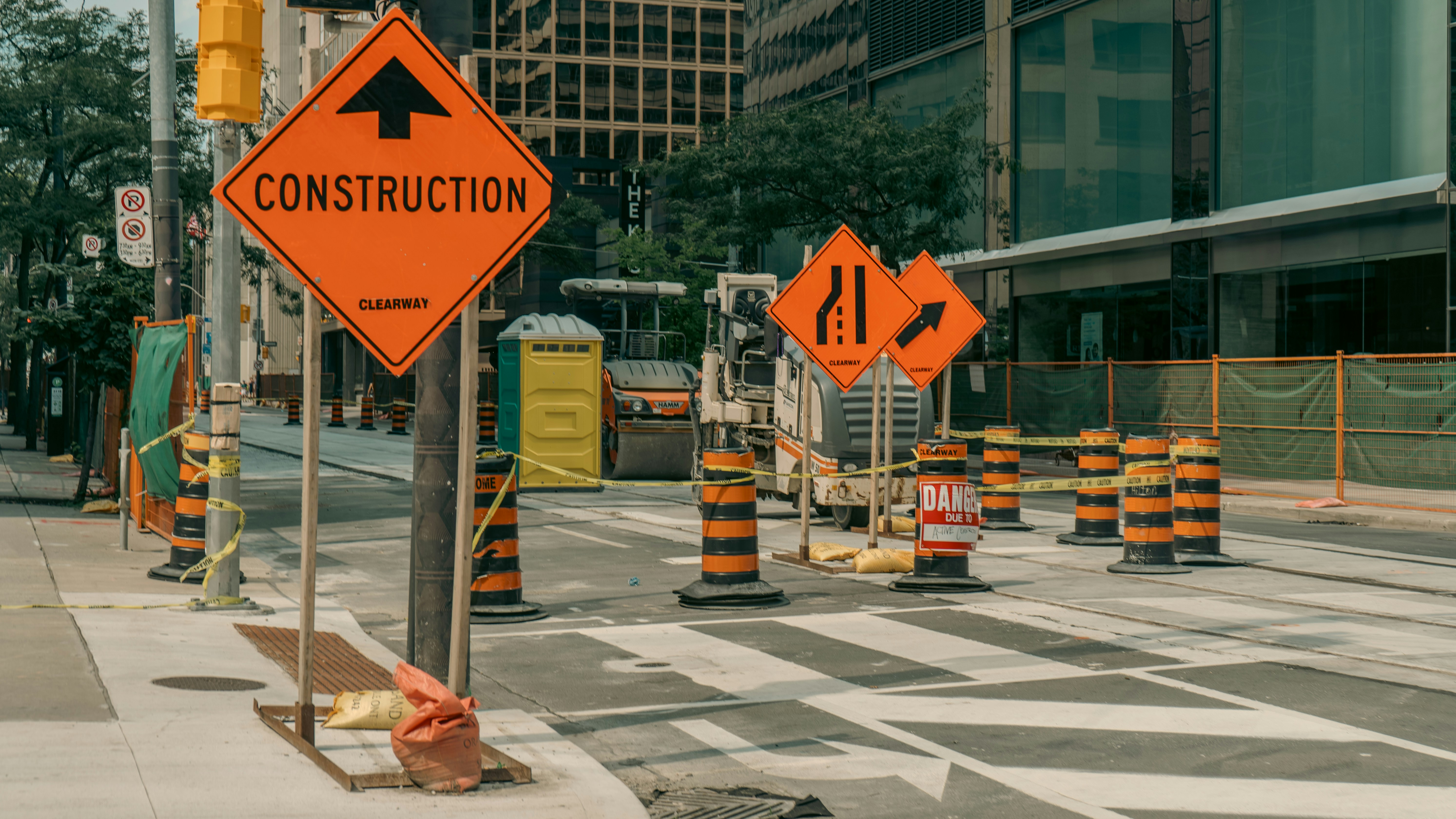 Construction signs and cones on a city street photo – Free Construction ...