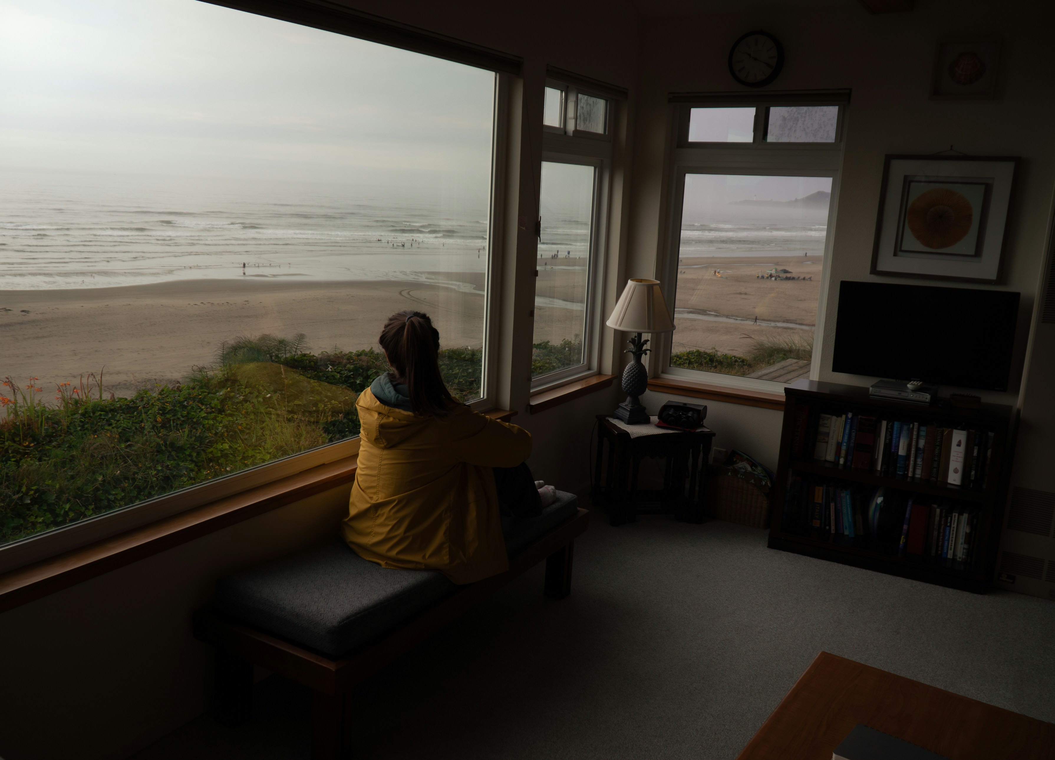 Window-side Reverie: A Mustard Jacket Watches the Sea