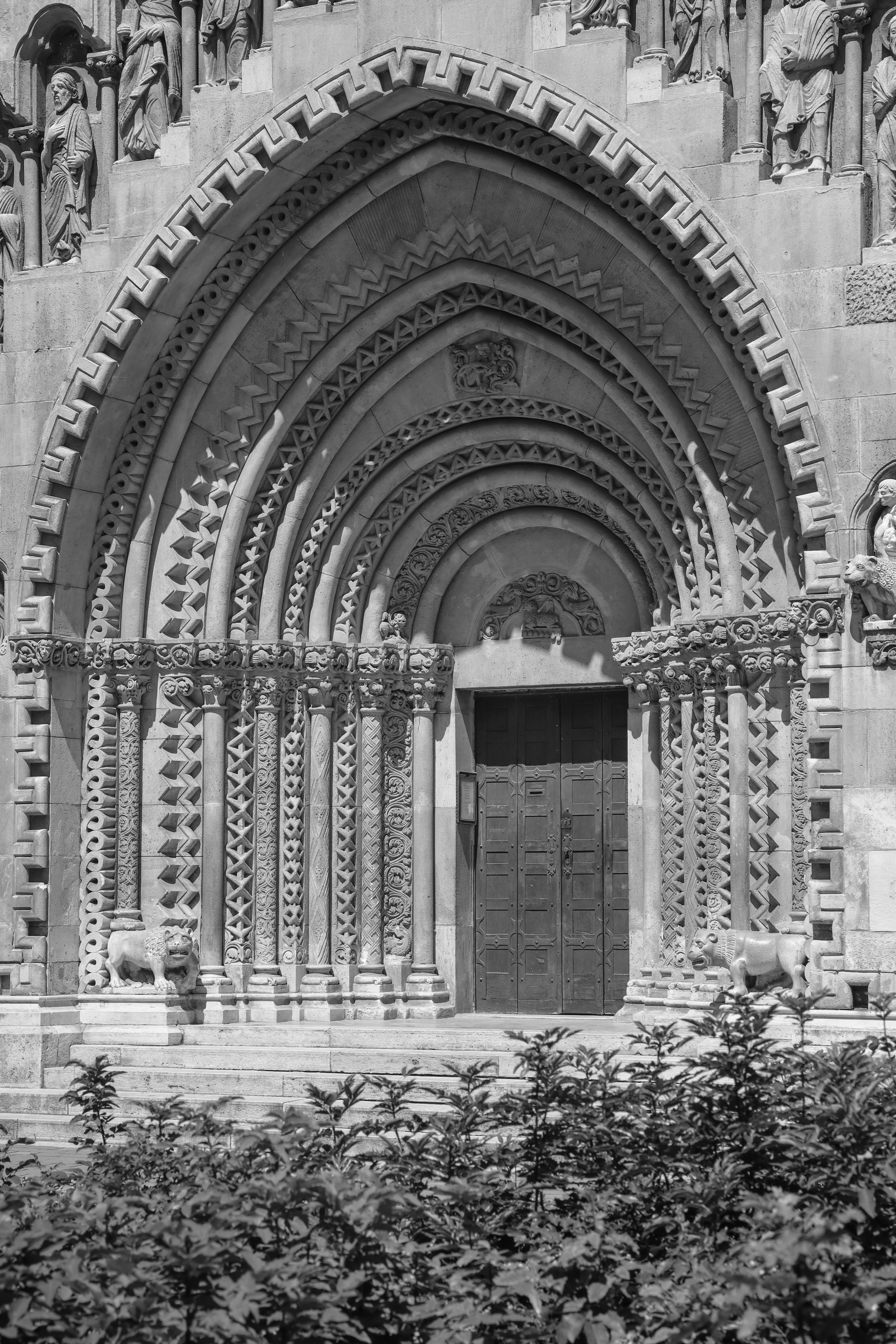 Concentric Arch Portal: Carved Stone Facade Framing a Central Door