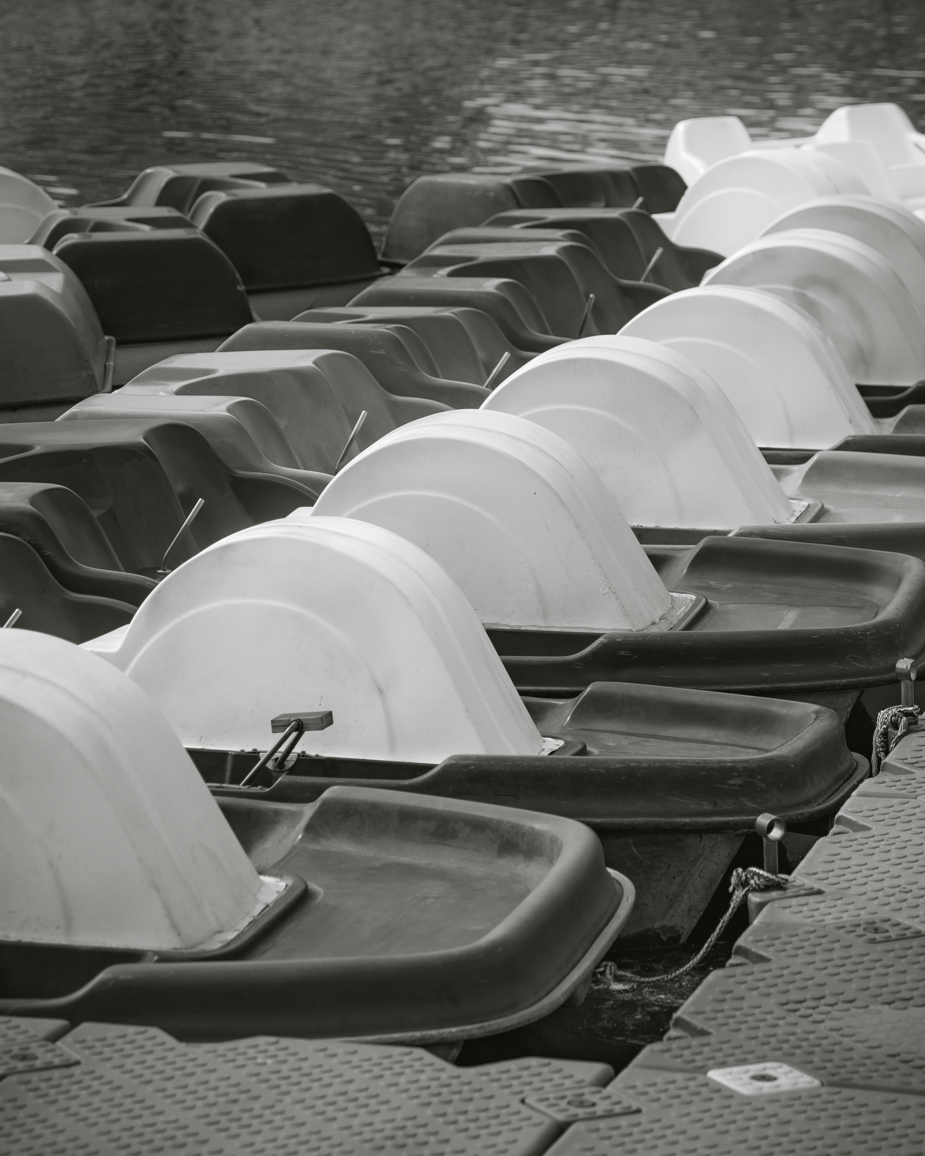 Monochrome Marina Rhythm: Curved Hulls in a Diagonal Row