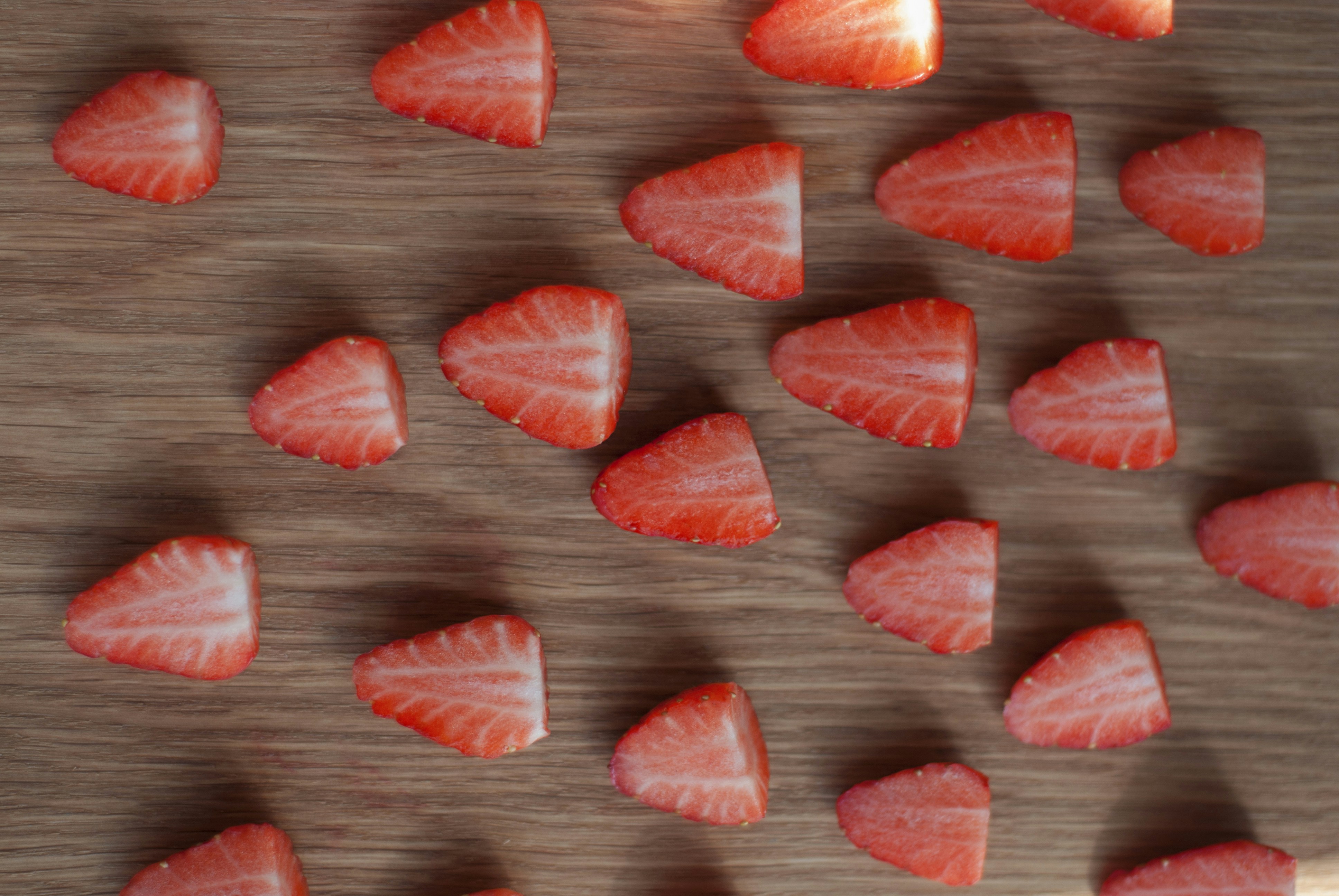 Red Confections on a Warm Wood Canvas