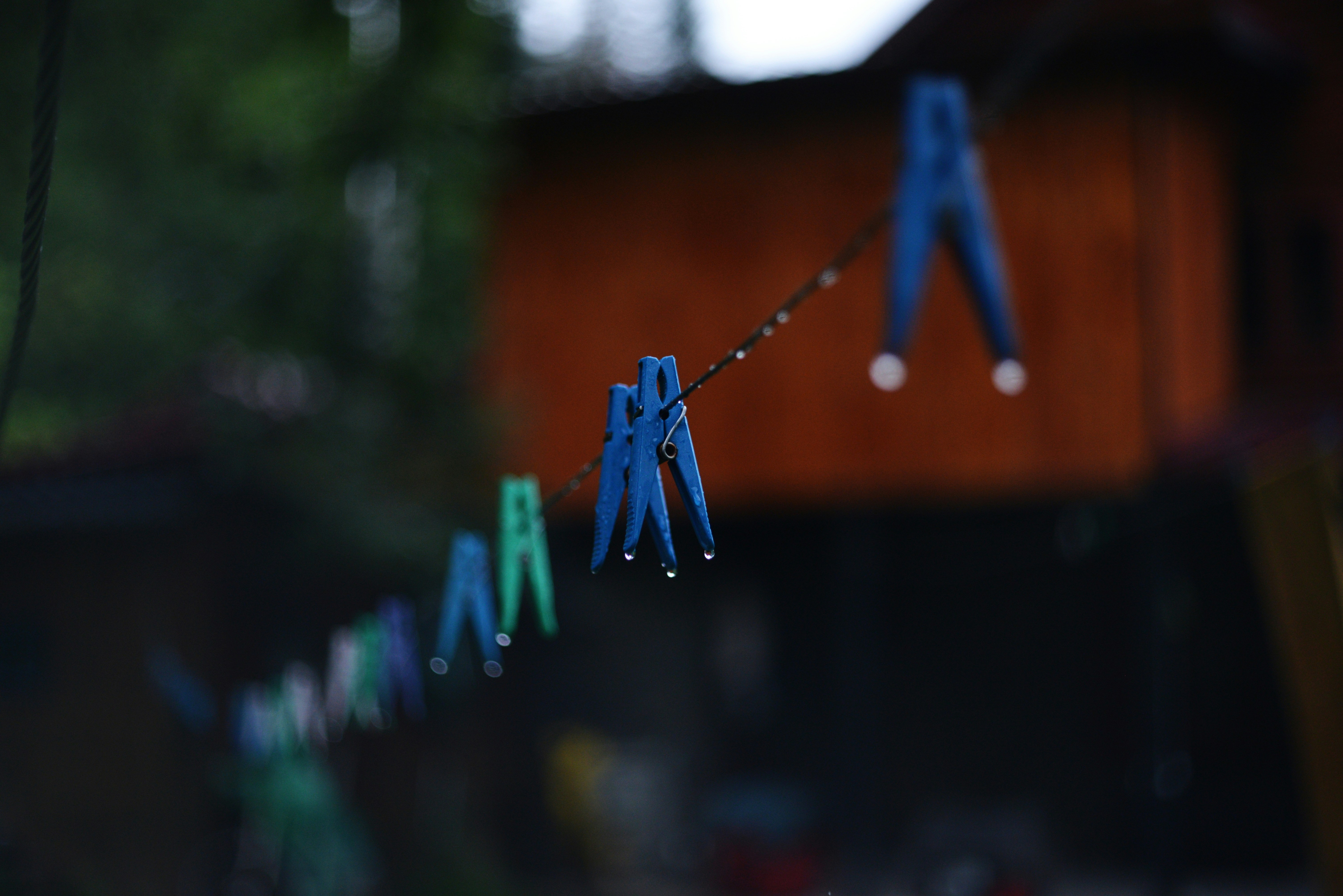 Blue Clip in Focus on a Weathered Clothesline