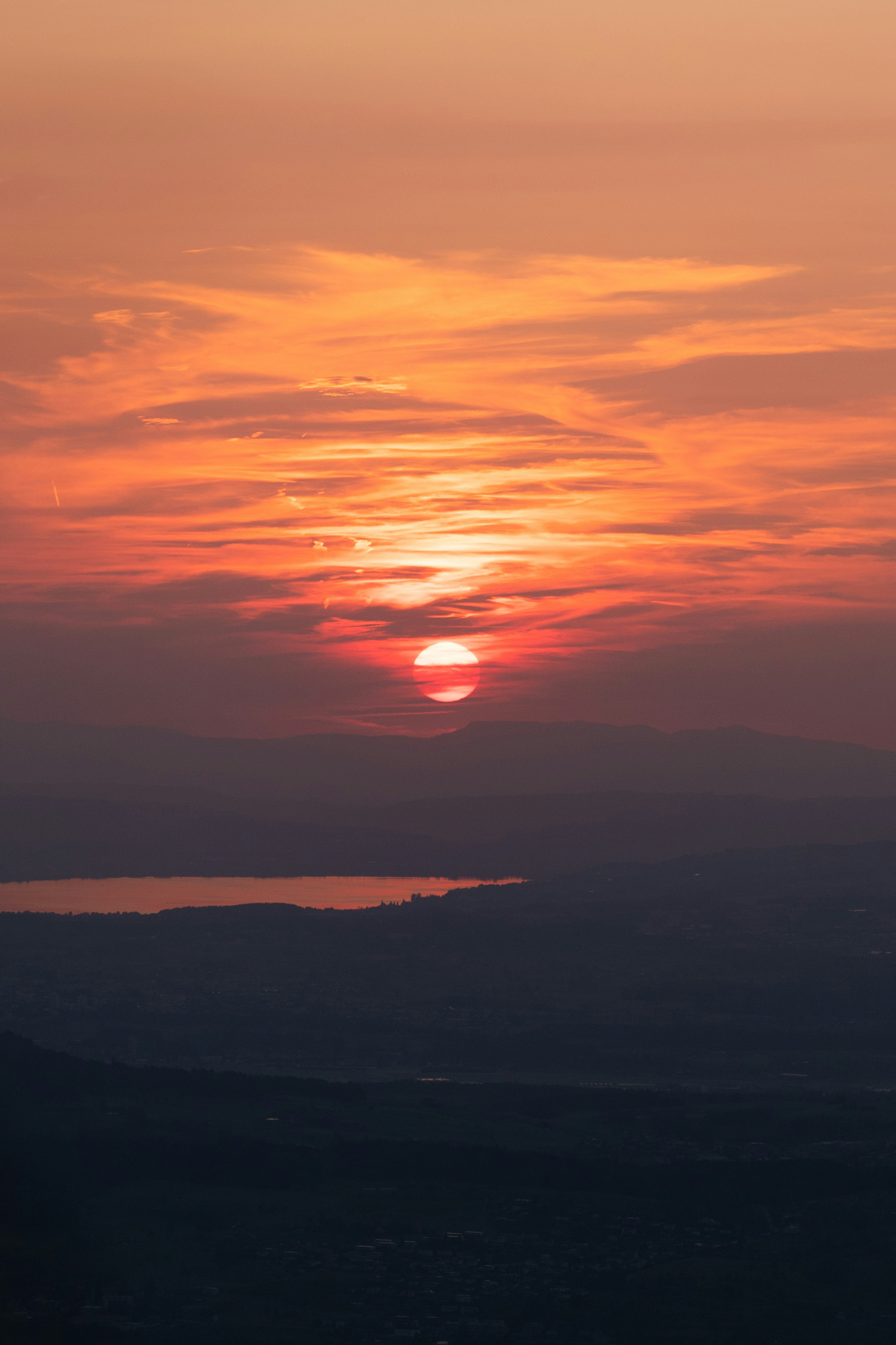 The sun is setting over a body of water photo – Free Summer Image on ...