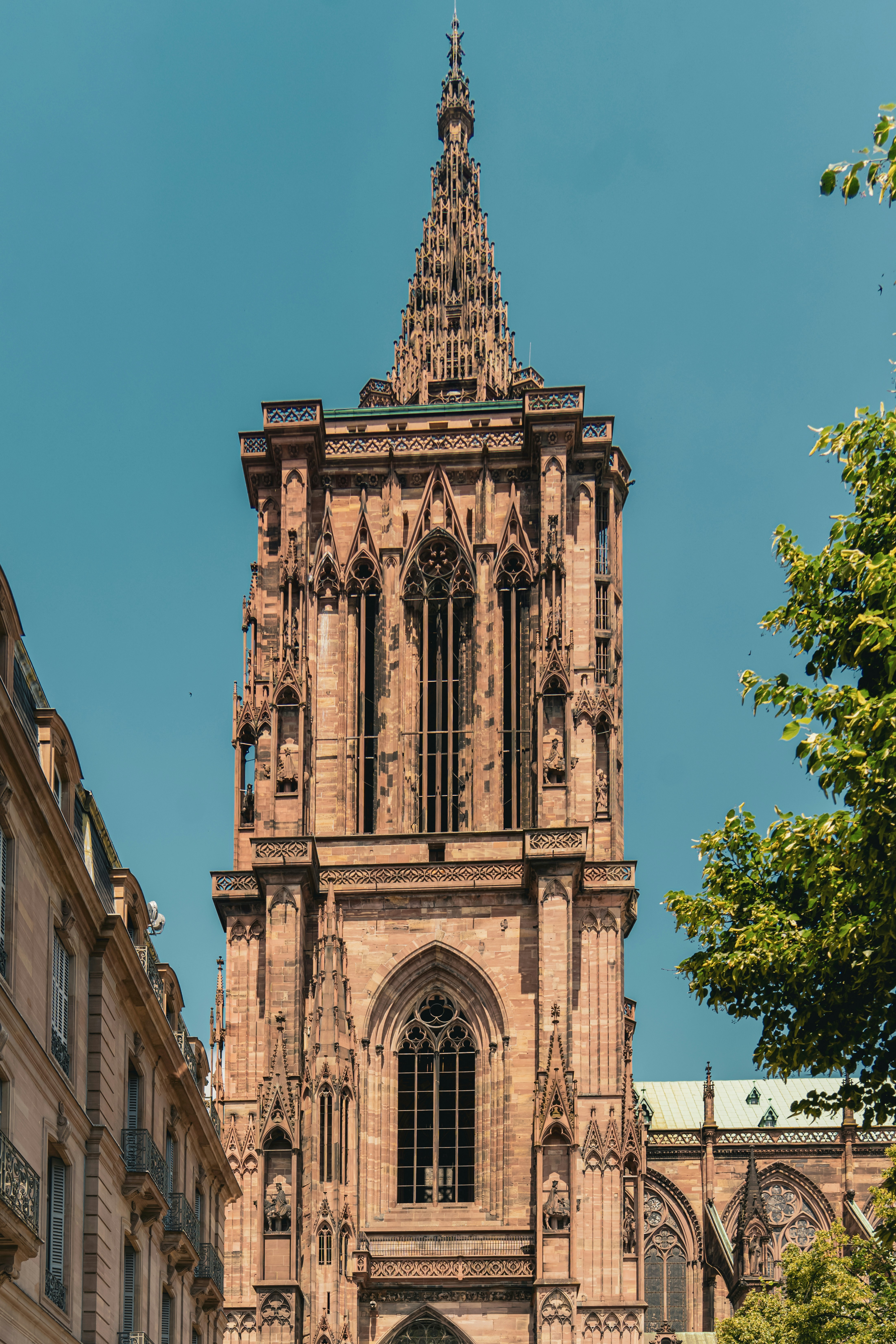 Gothic Spire Framing a Sunlit Cityscape