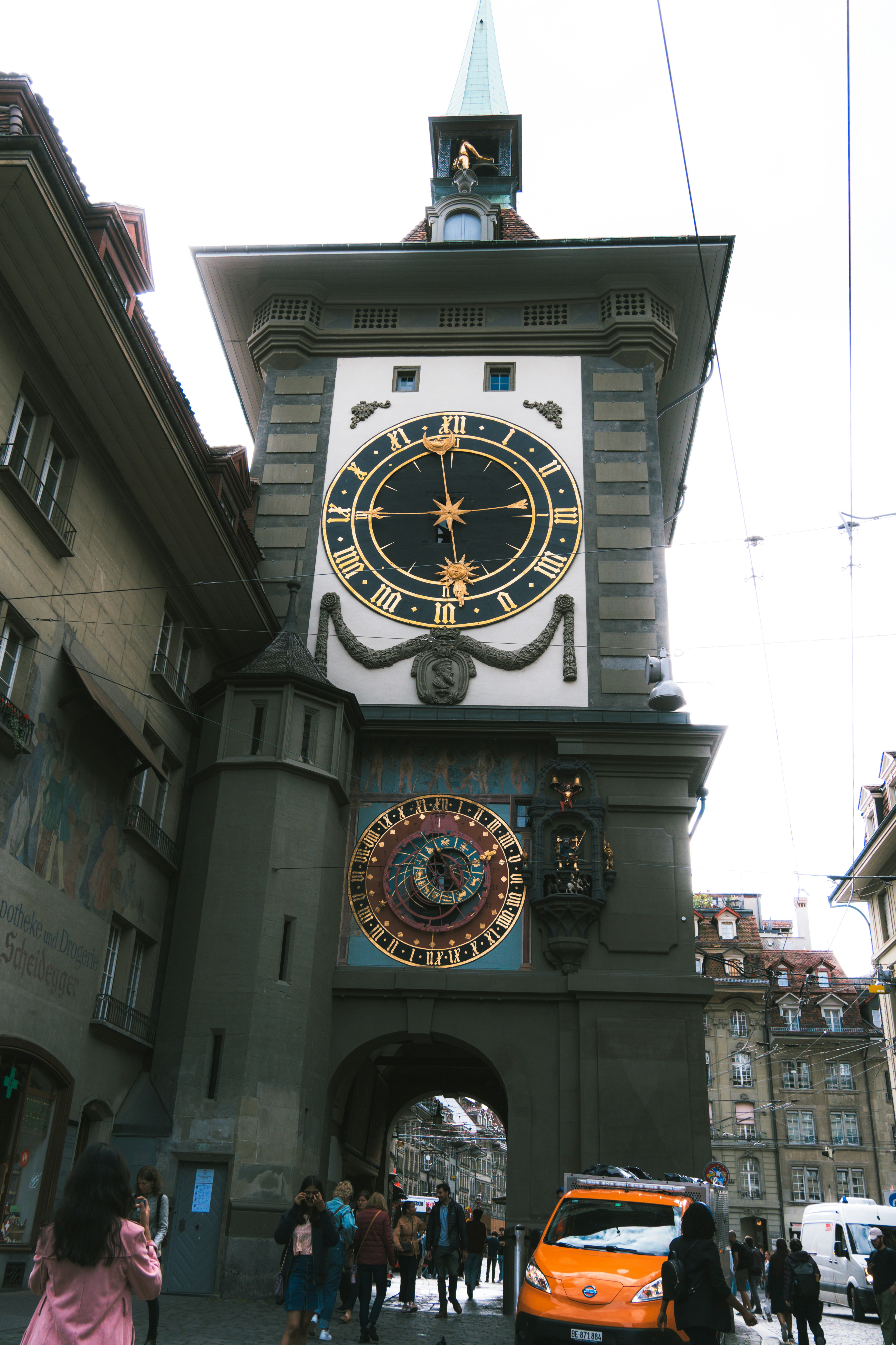 A large clock tower with a clock on it's side photo – Free Building ...