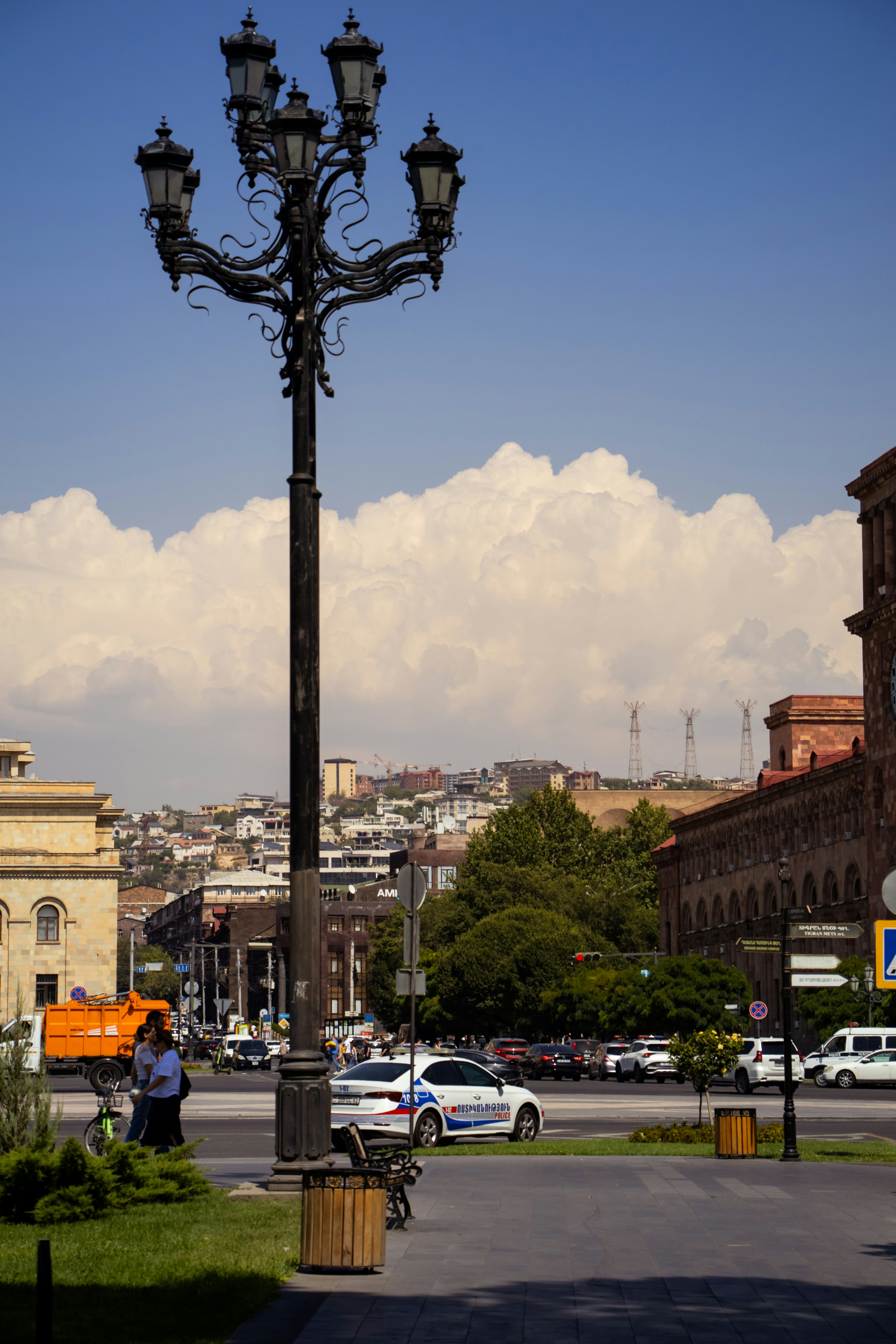 Ornate Lamp Post Anchors a Sunlit European Streetscape