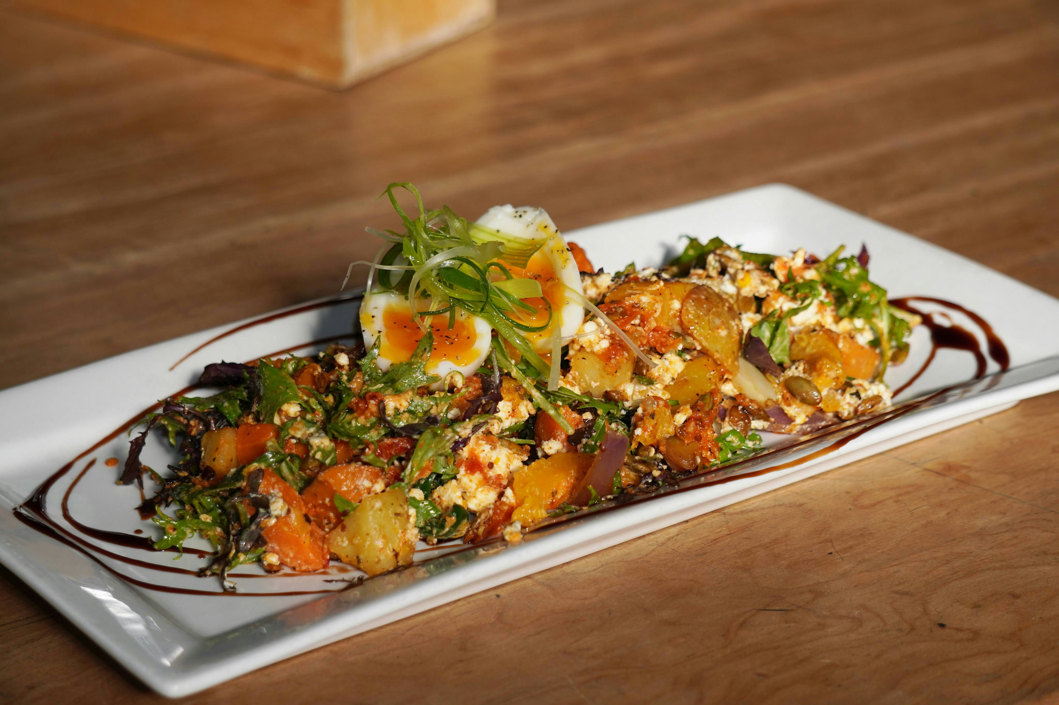 A plate of food on a wooden table photo – Free Egg Image on Unsplash