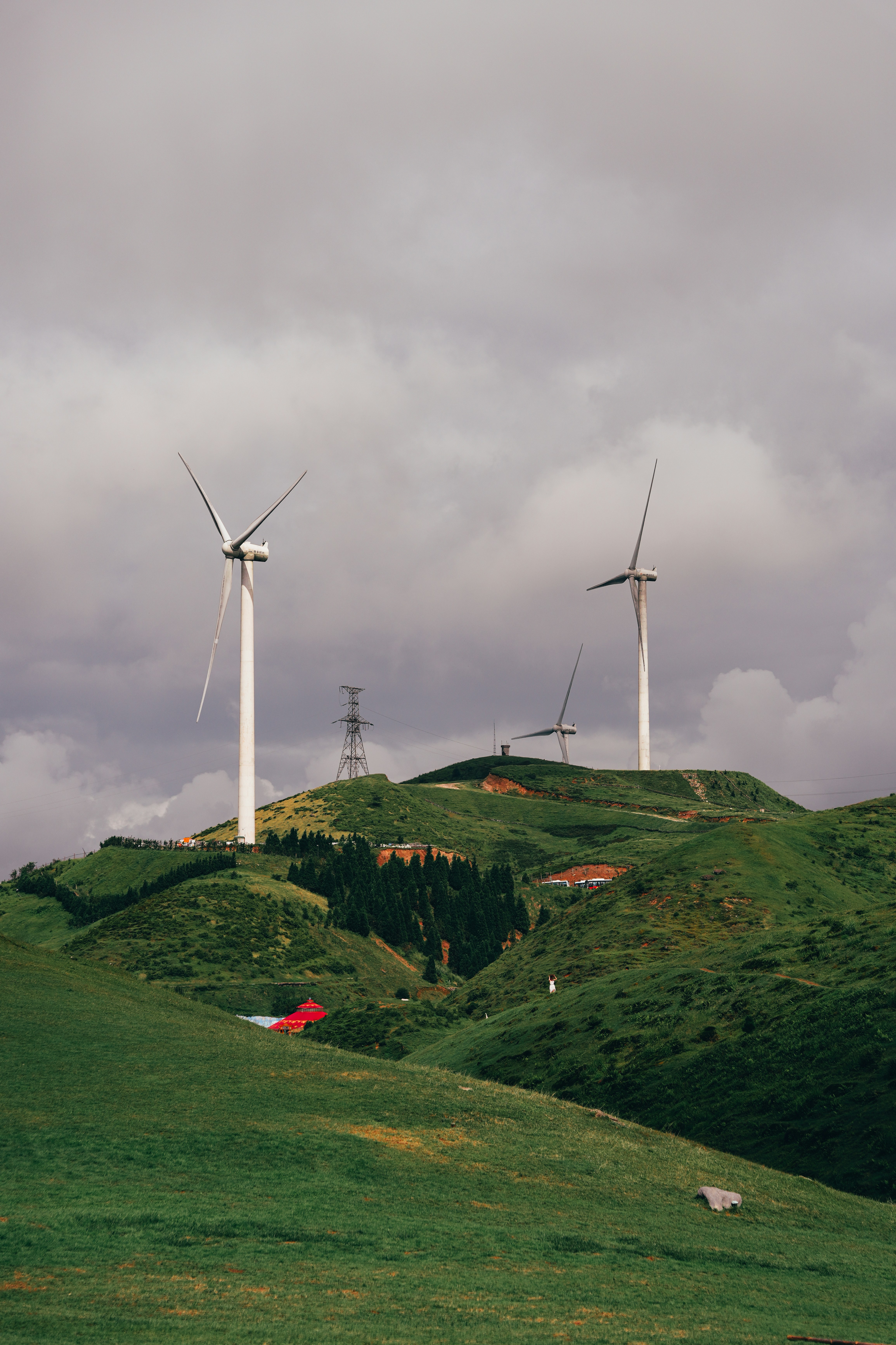 A group of wind turbines on top of a hill photo – Free Yangtianhu ...