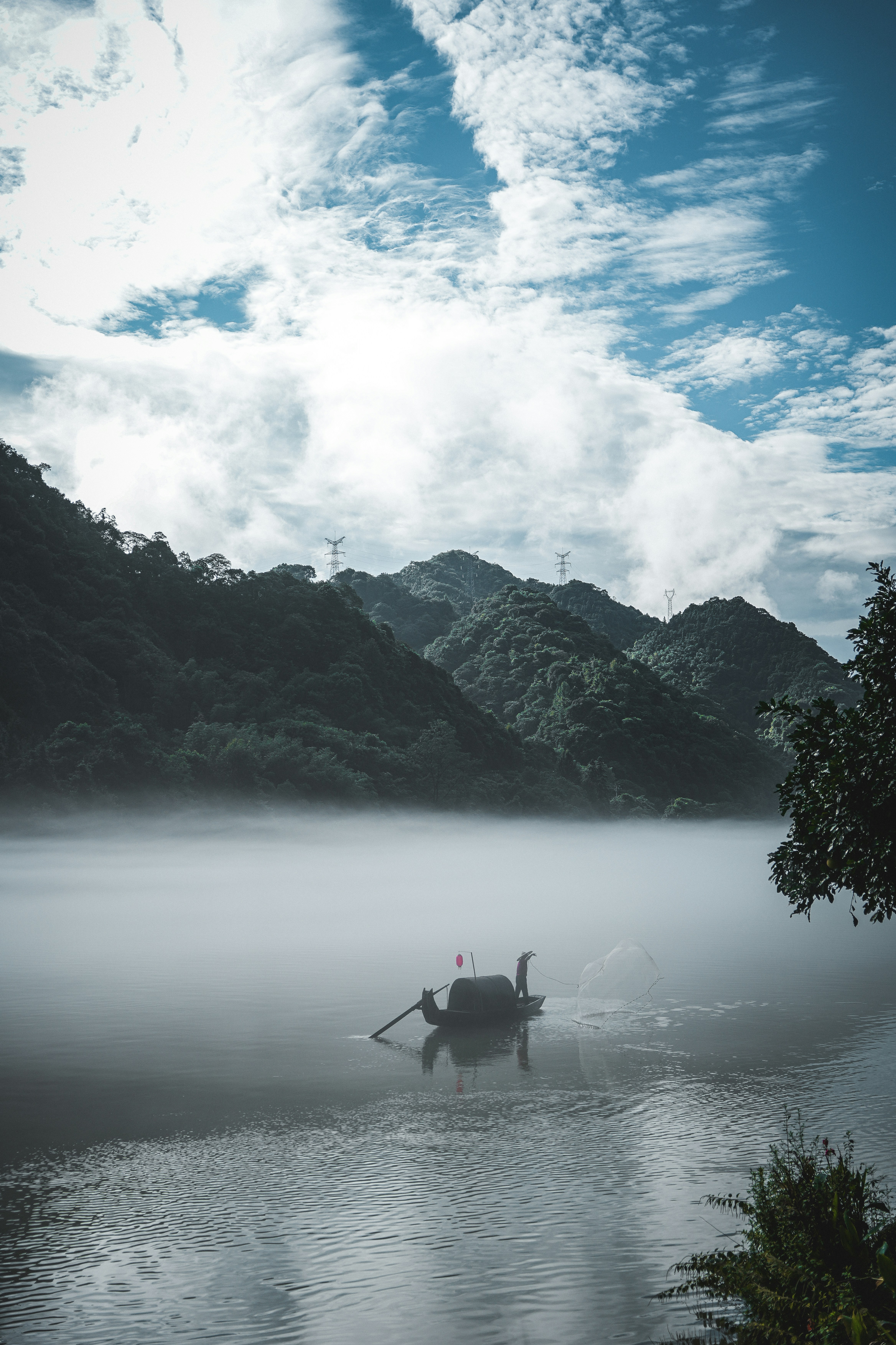 A person rowing a boat on a lake photo – Free Dongjiang lake Image on ...