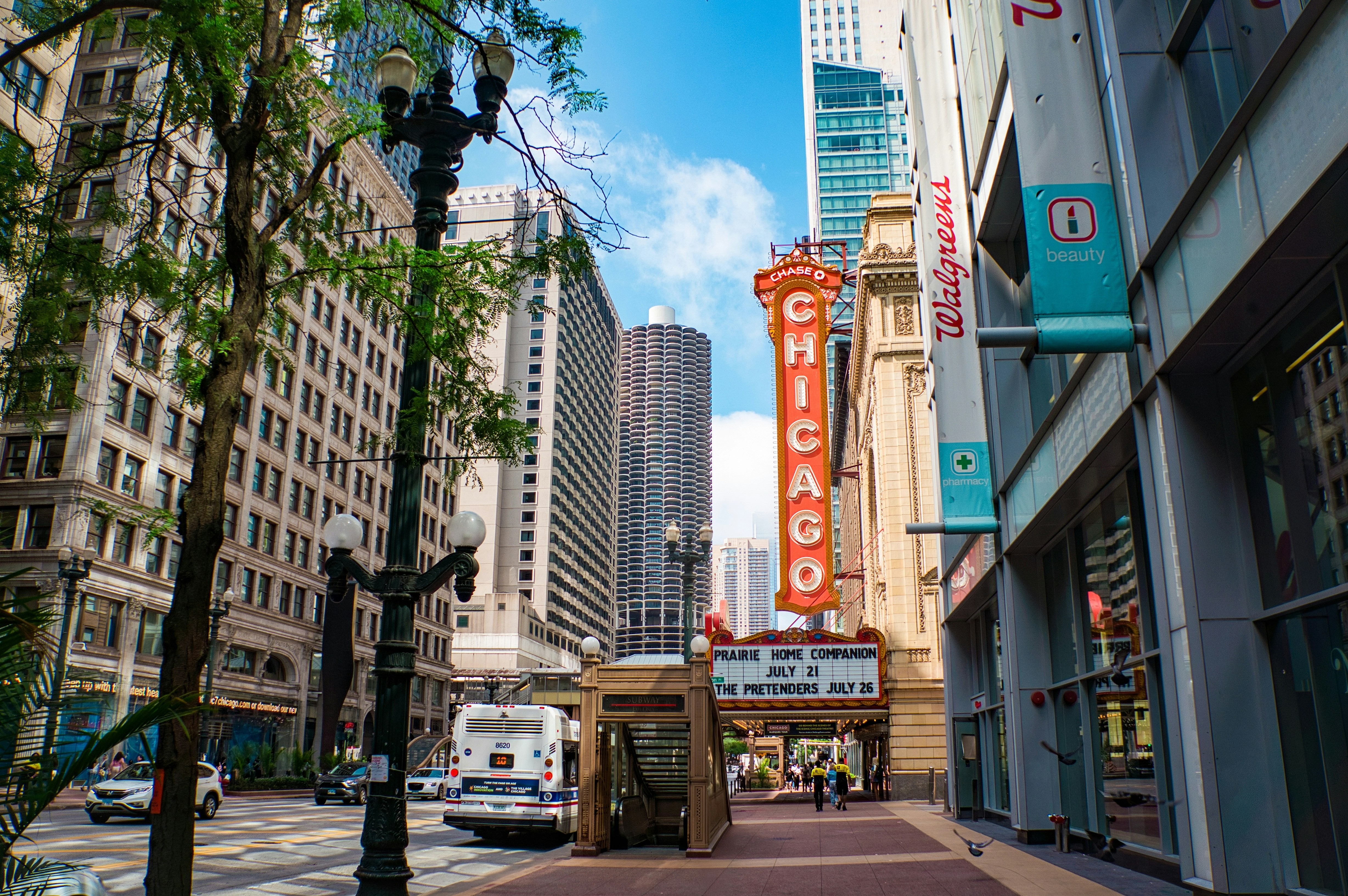 A city street with tall buildings and a sign photo – Free Chicago Image ...