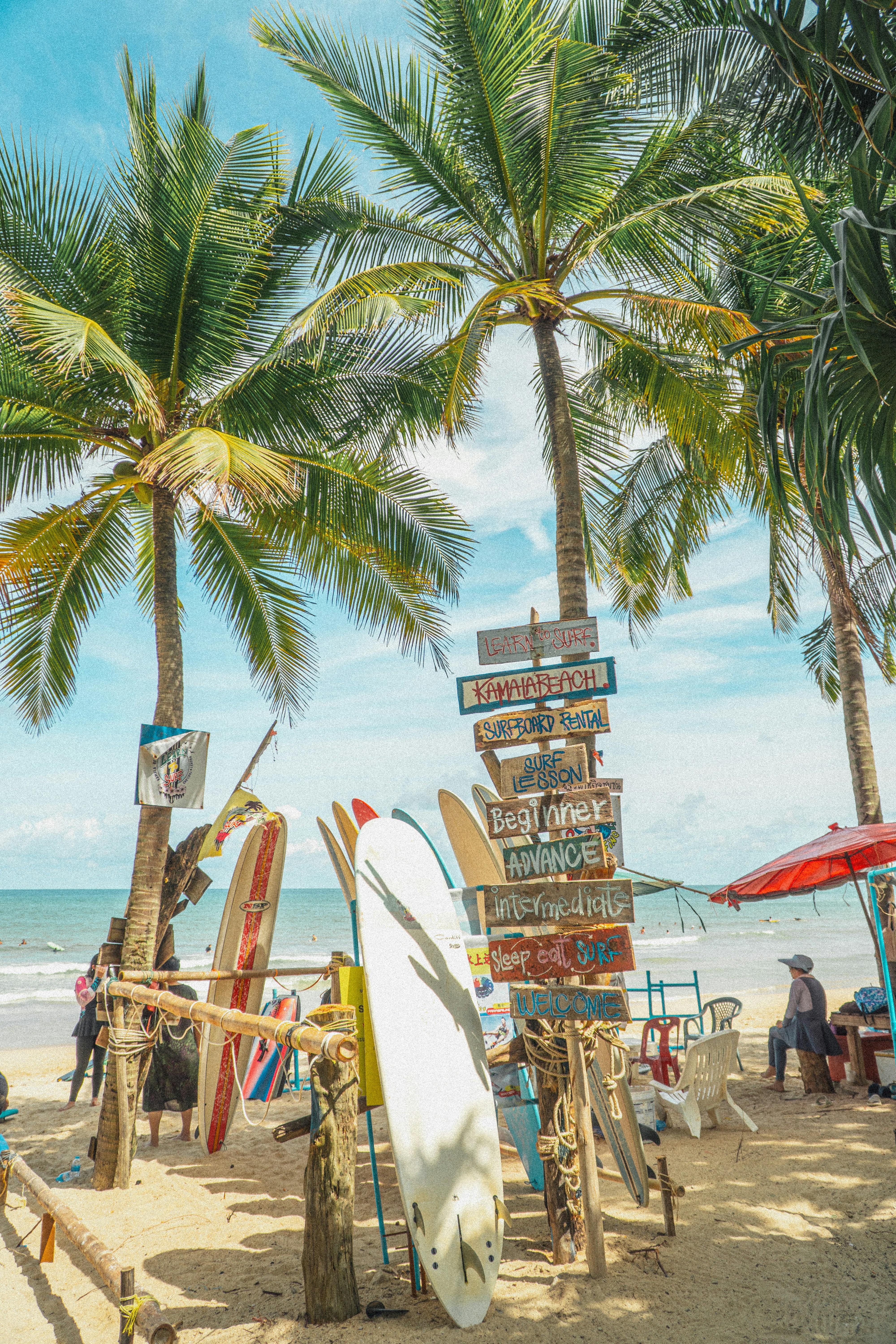 A bunch of surfboards that are on a beach photo – Free Kamala beach ...
