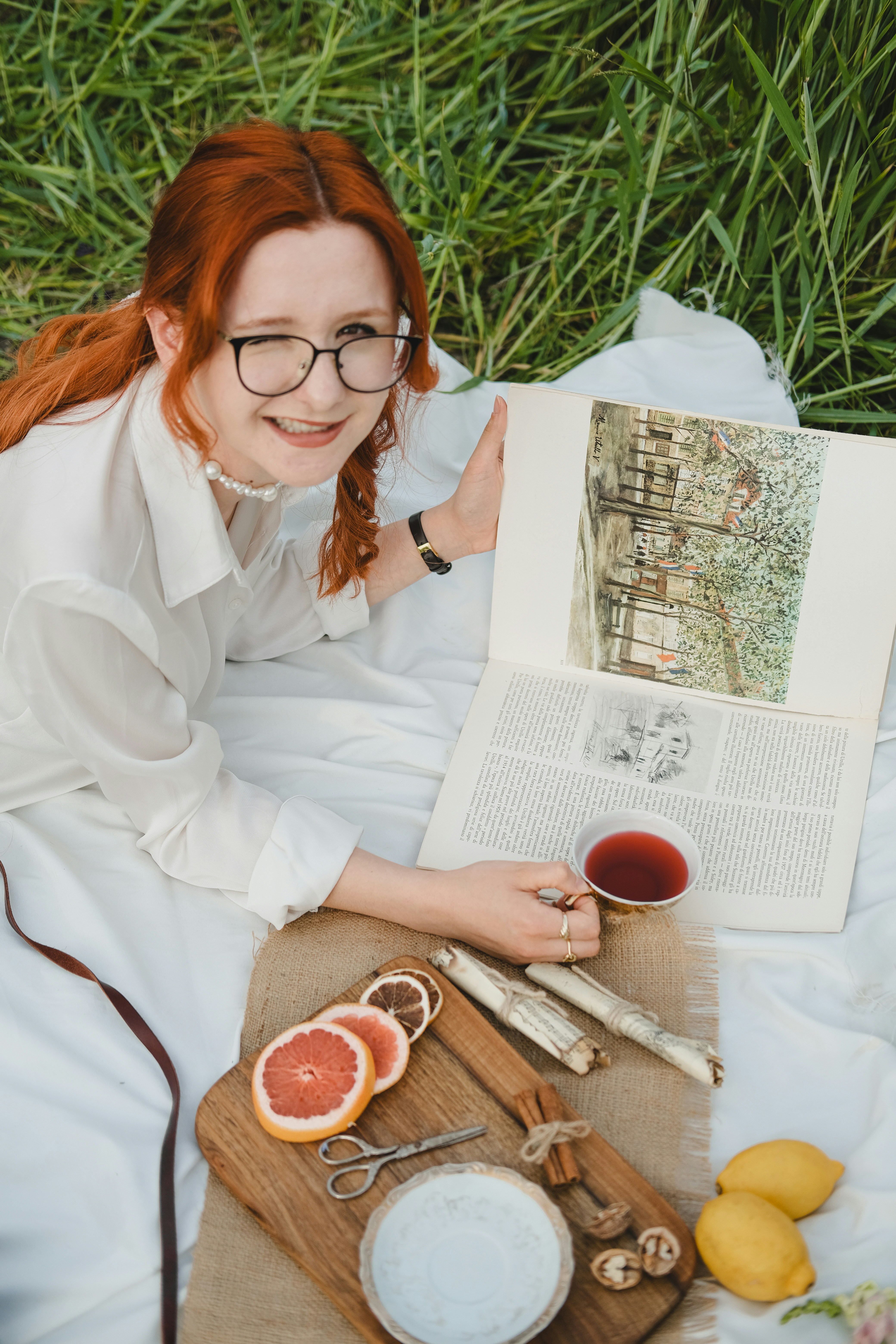 Red-haired Scholar in the Grass: Tea, Tempting Citrus, and a Quiet Read