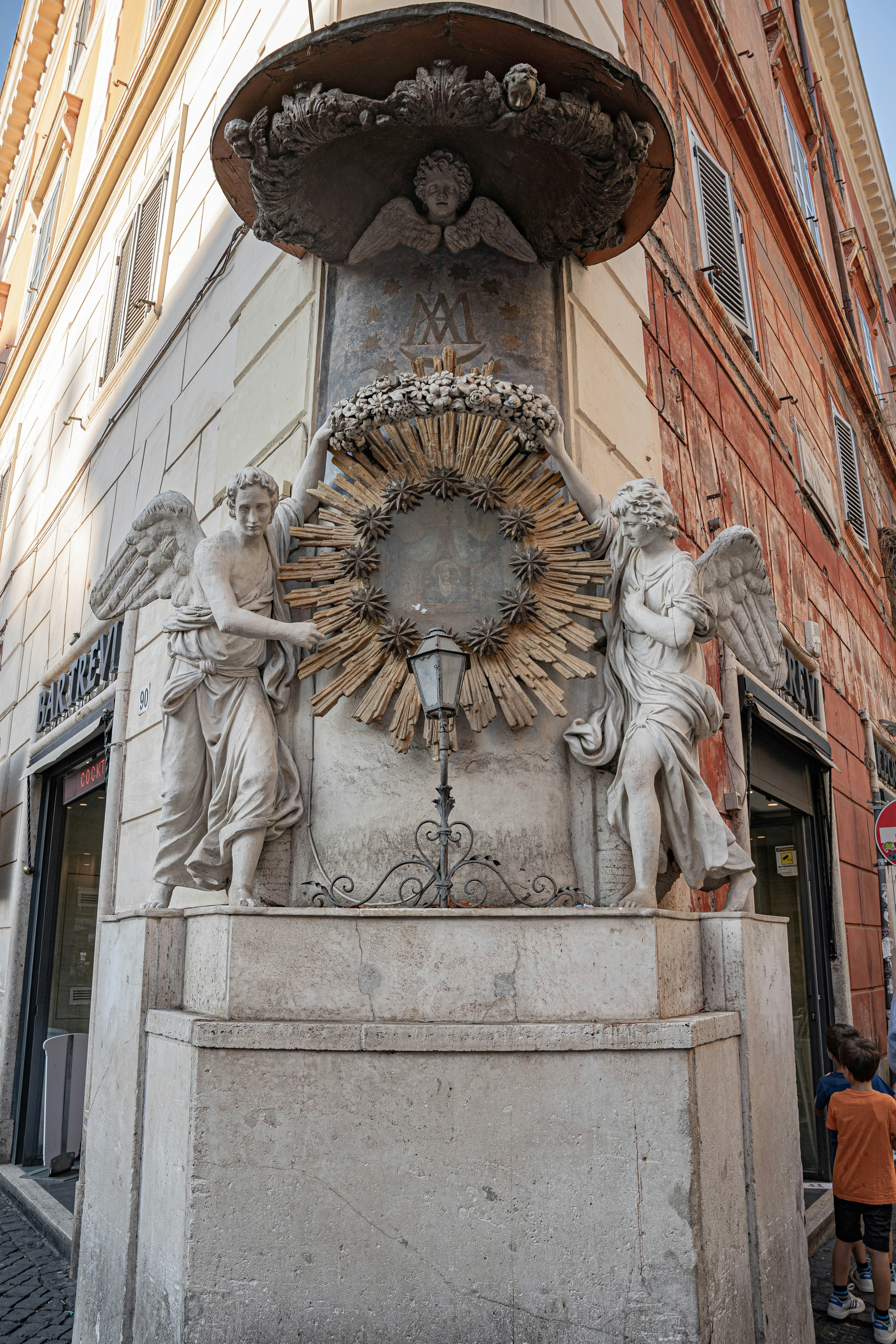 Sunburst Medallion at a Corner Fountain, Guarded by Angelic Figures