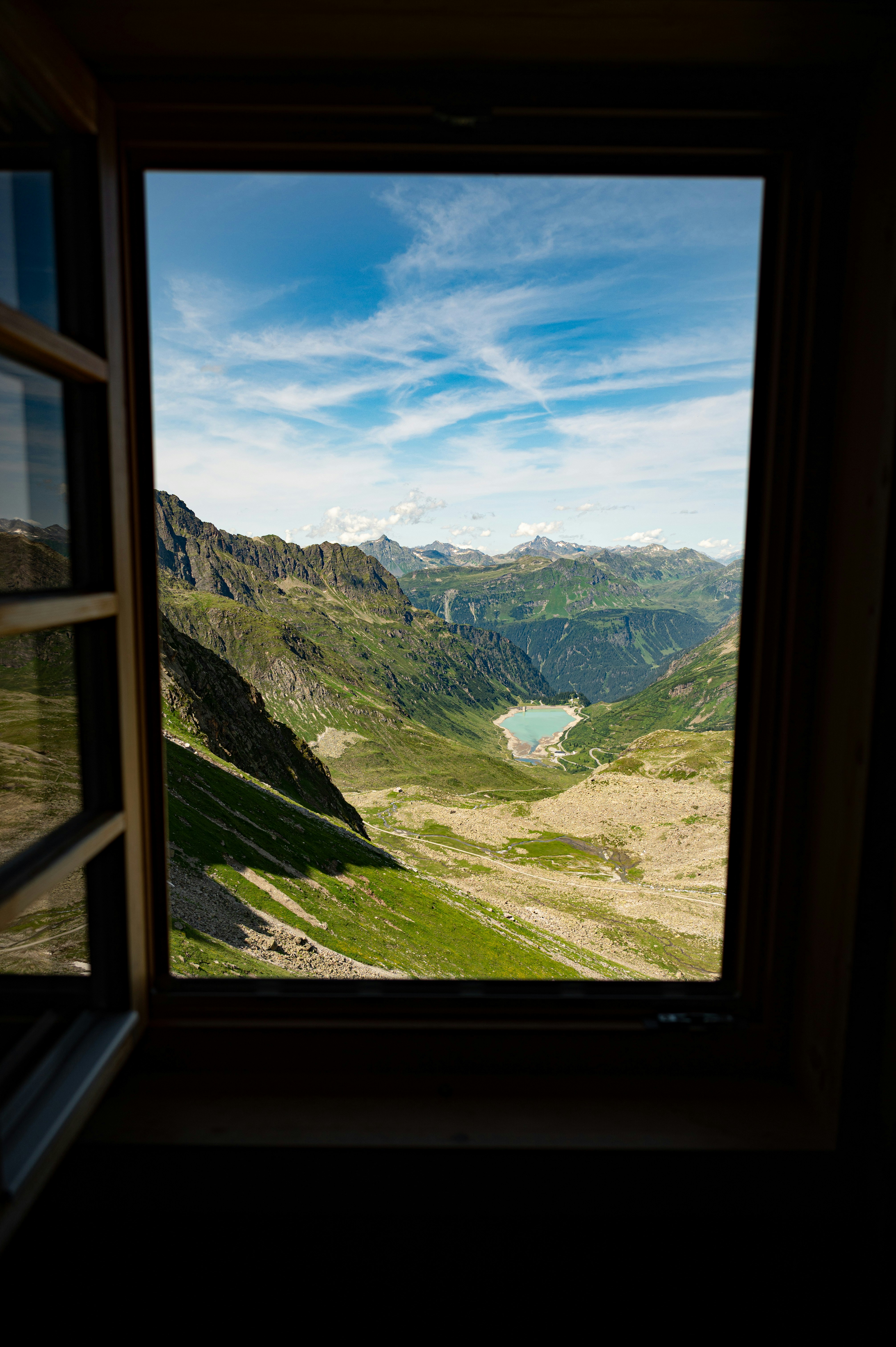 A window with a view of mountains and a lake photo – Free Alpen Image ...