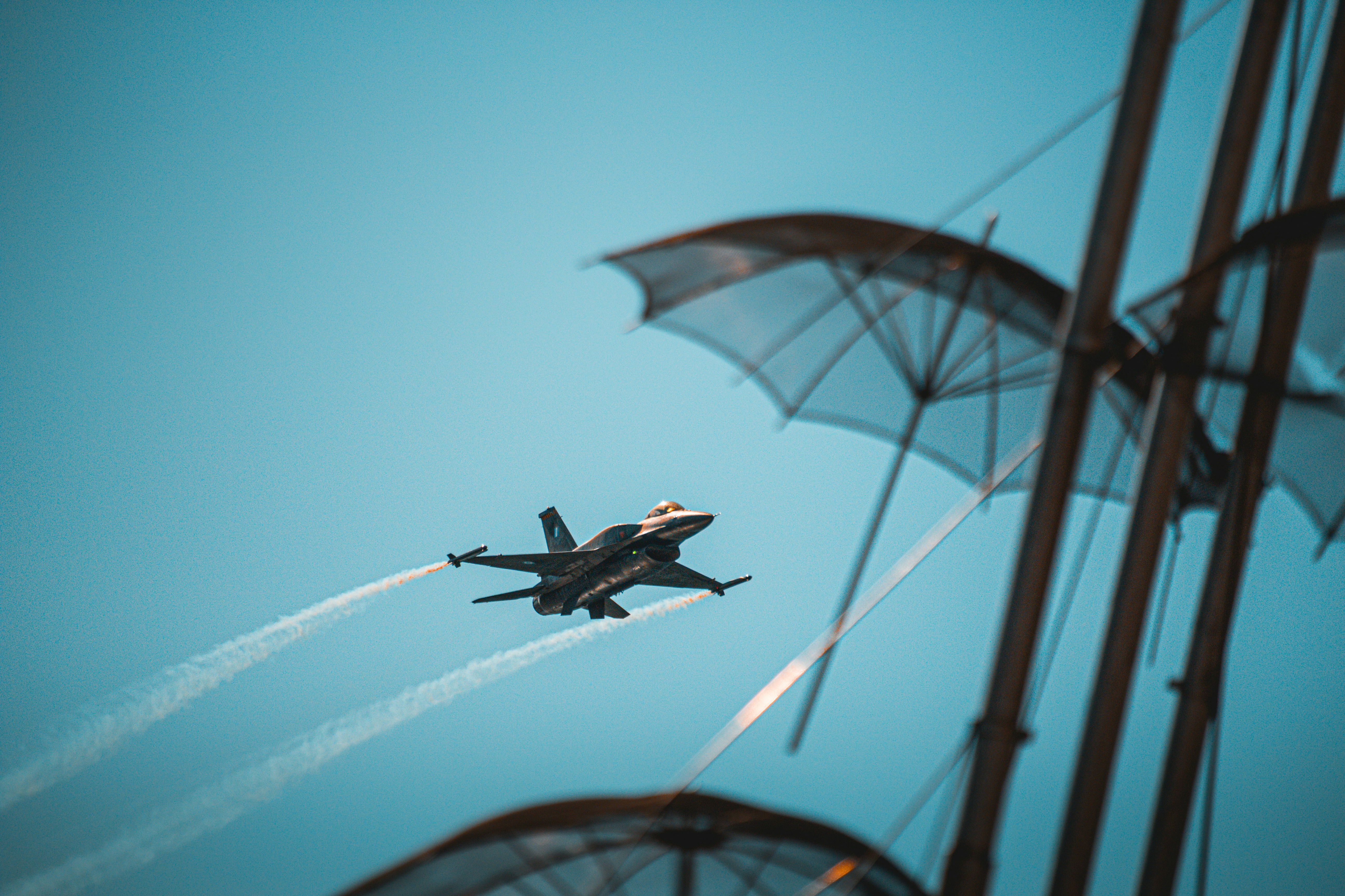 Contrails over Umbrella Arches: A Fighter Jet in the Sky