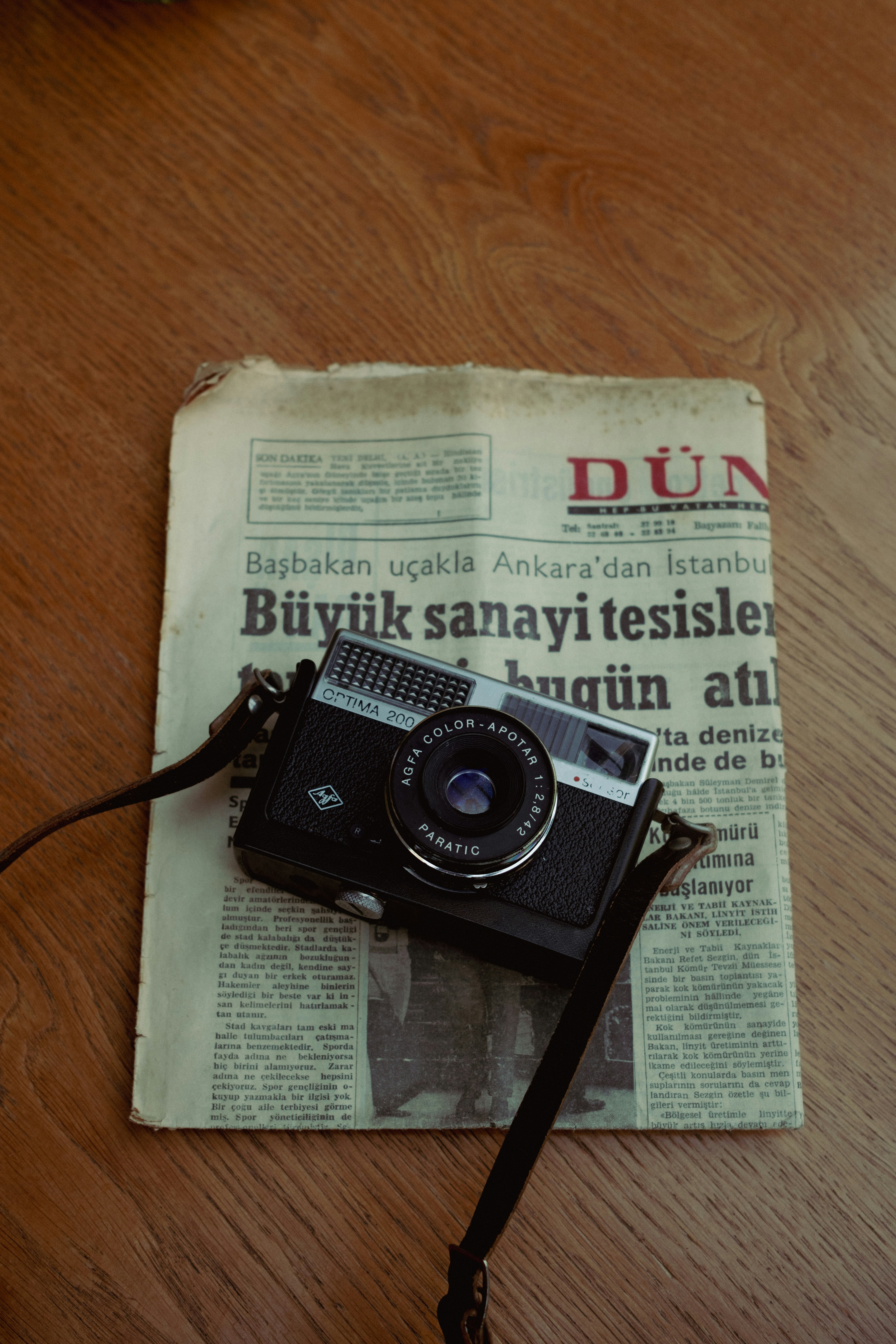 A camera sitting on top of a newspaper photo – Free Ankara Image on ...
