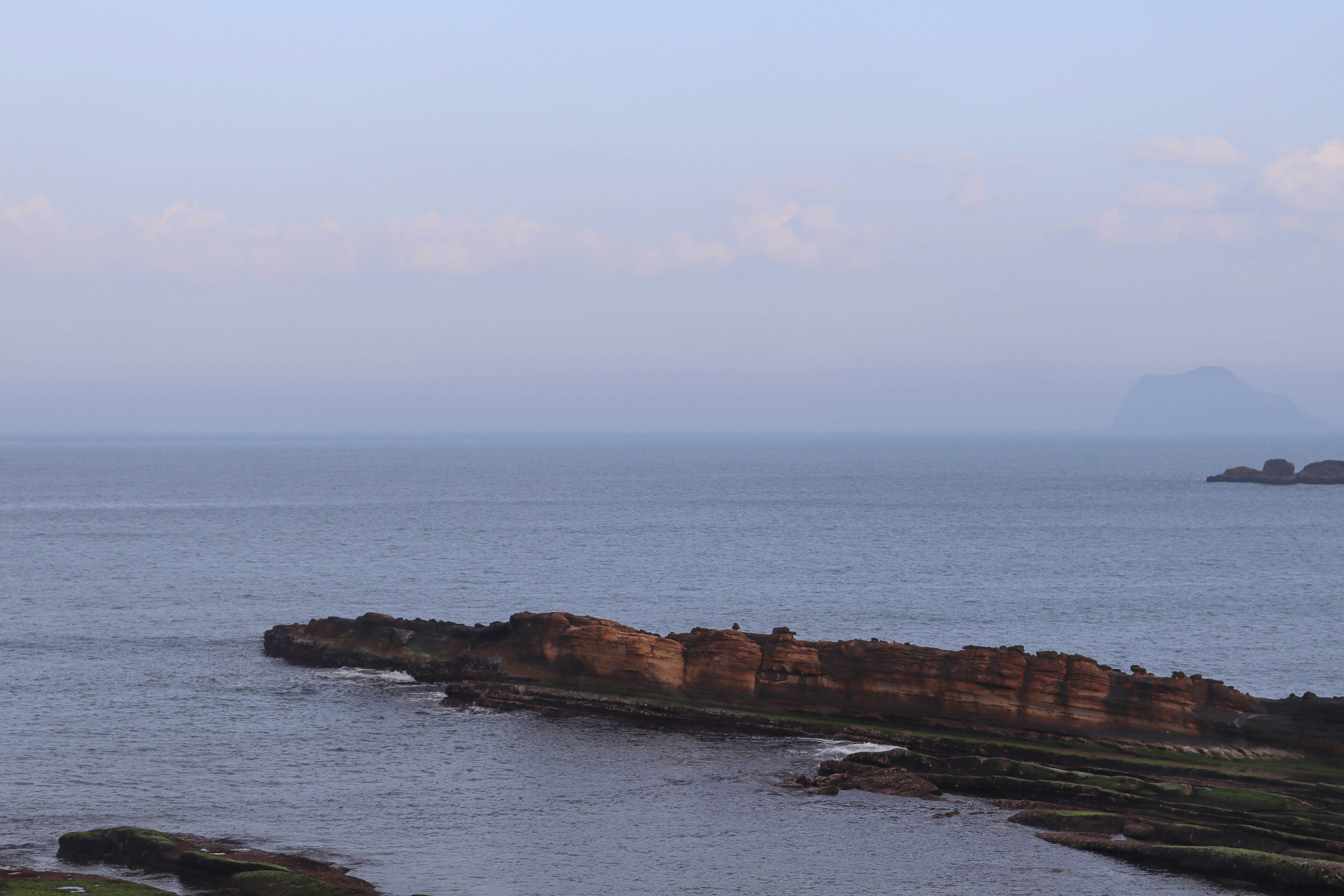 Basalt Ridge at the Edge of a Quiet Sea