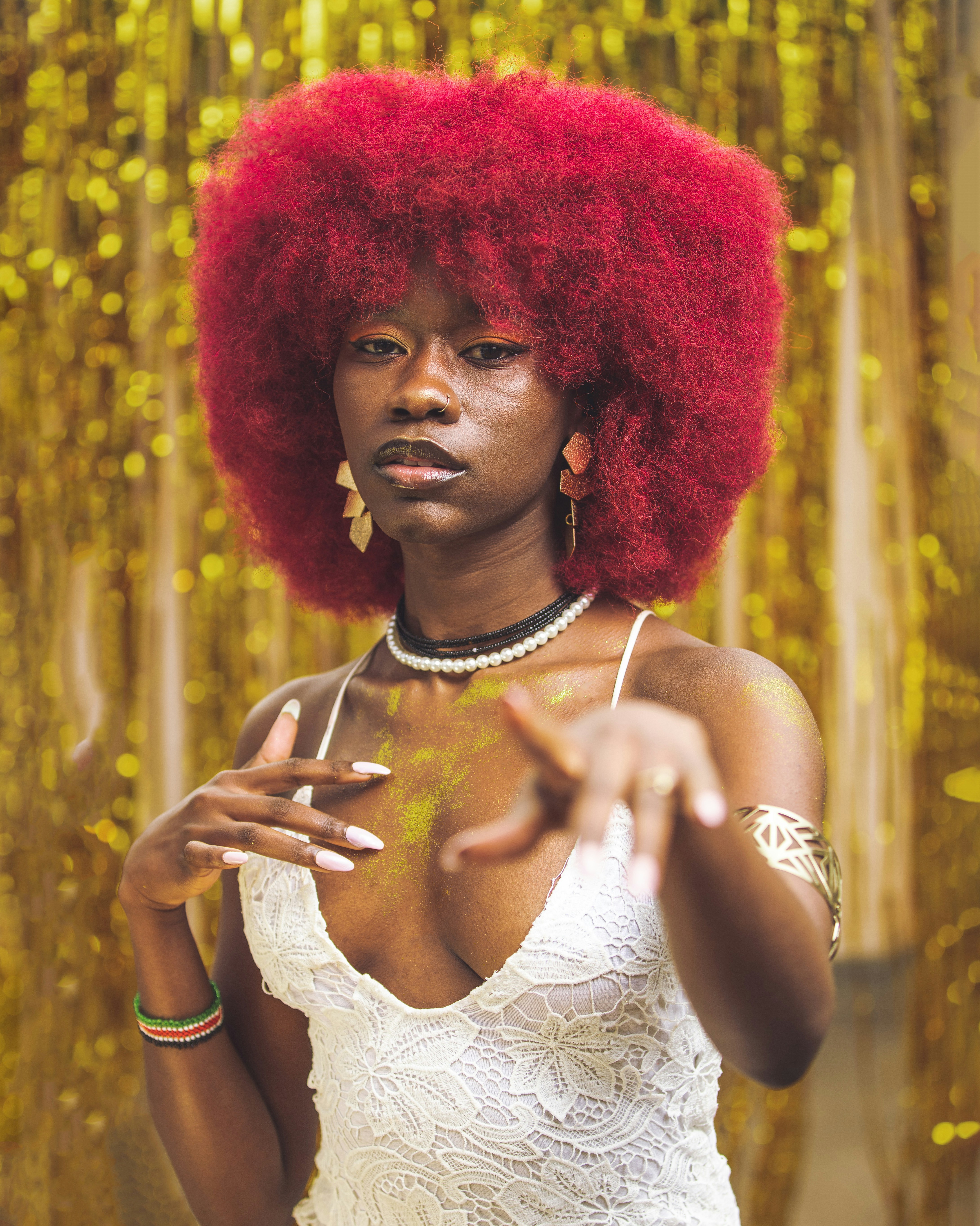 A woman with a red afro pointing at something photo – Free Birthday ...