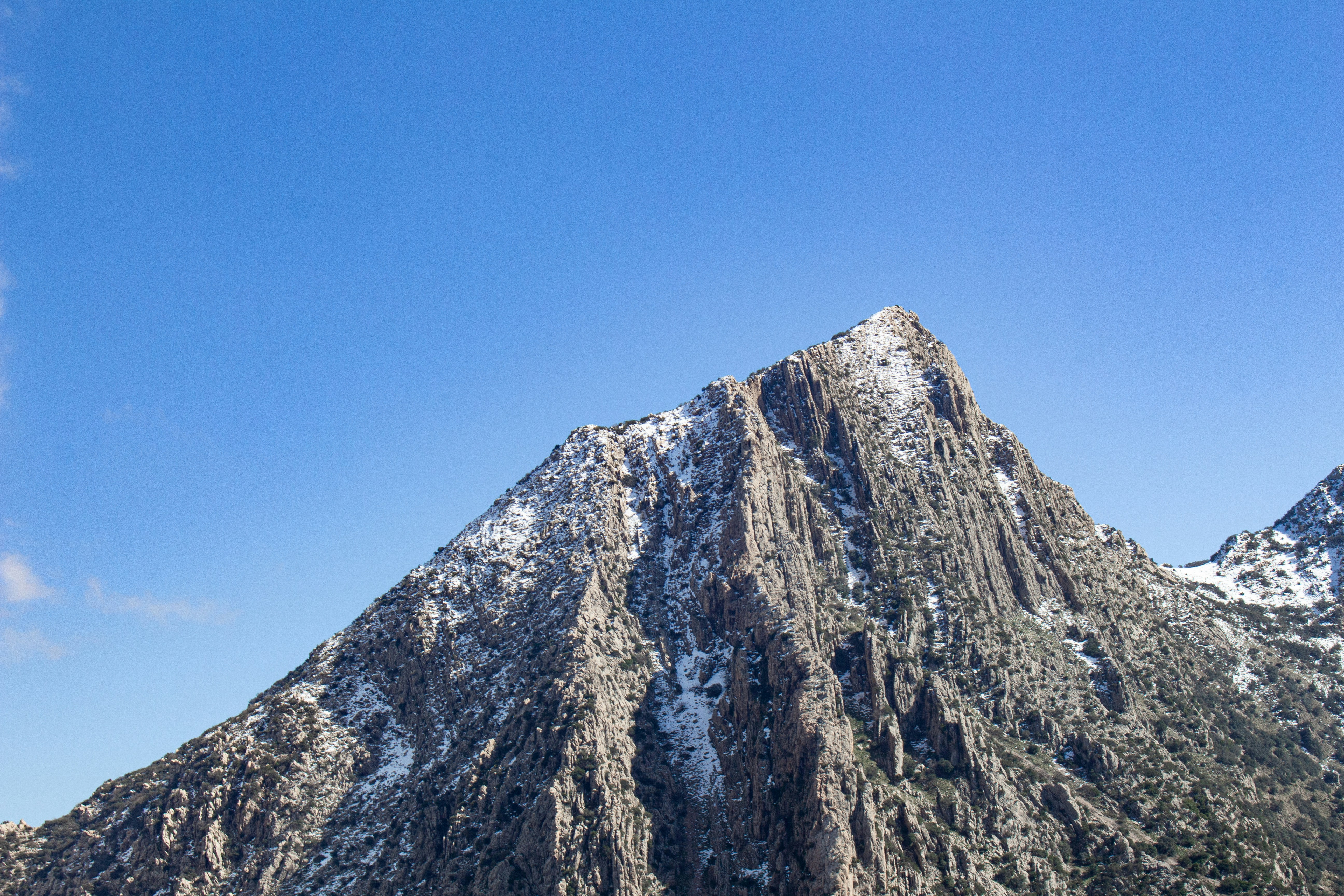 A large mountain with snow on top of it photo – Free Nature Image on ...