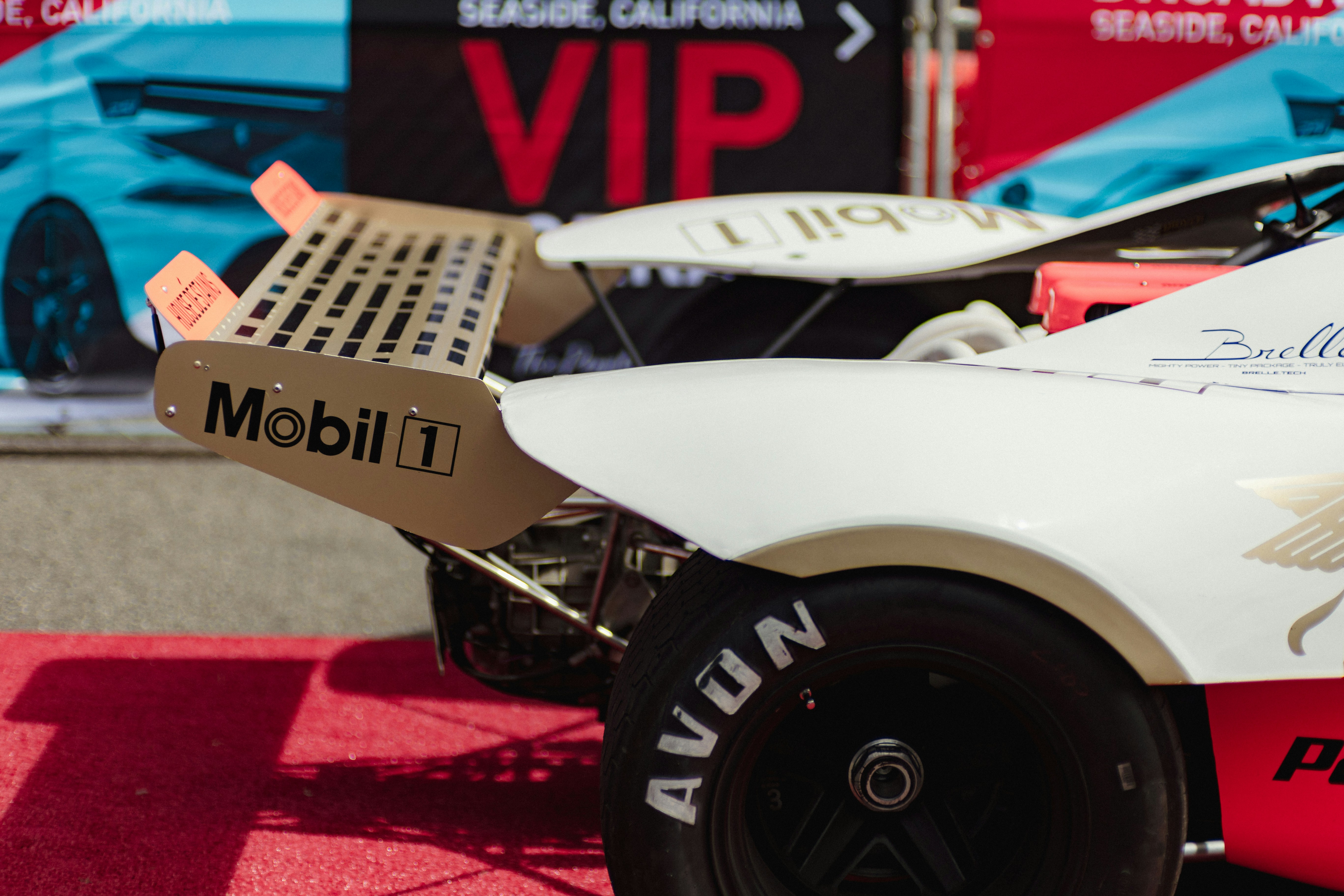 A race car is on display at a car show photo – Free Machine Image on ...