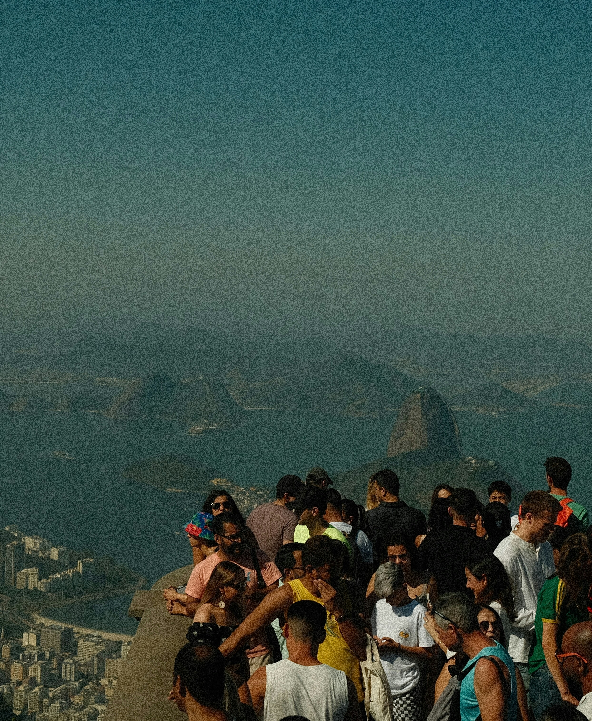 A group of people standing on top of a mountain