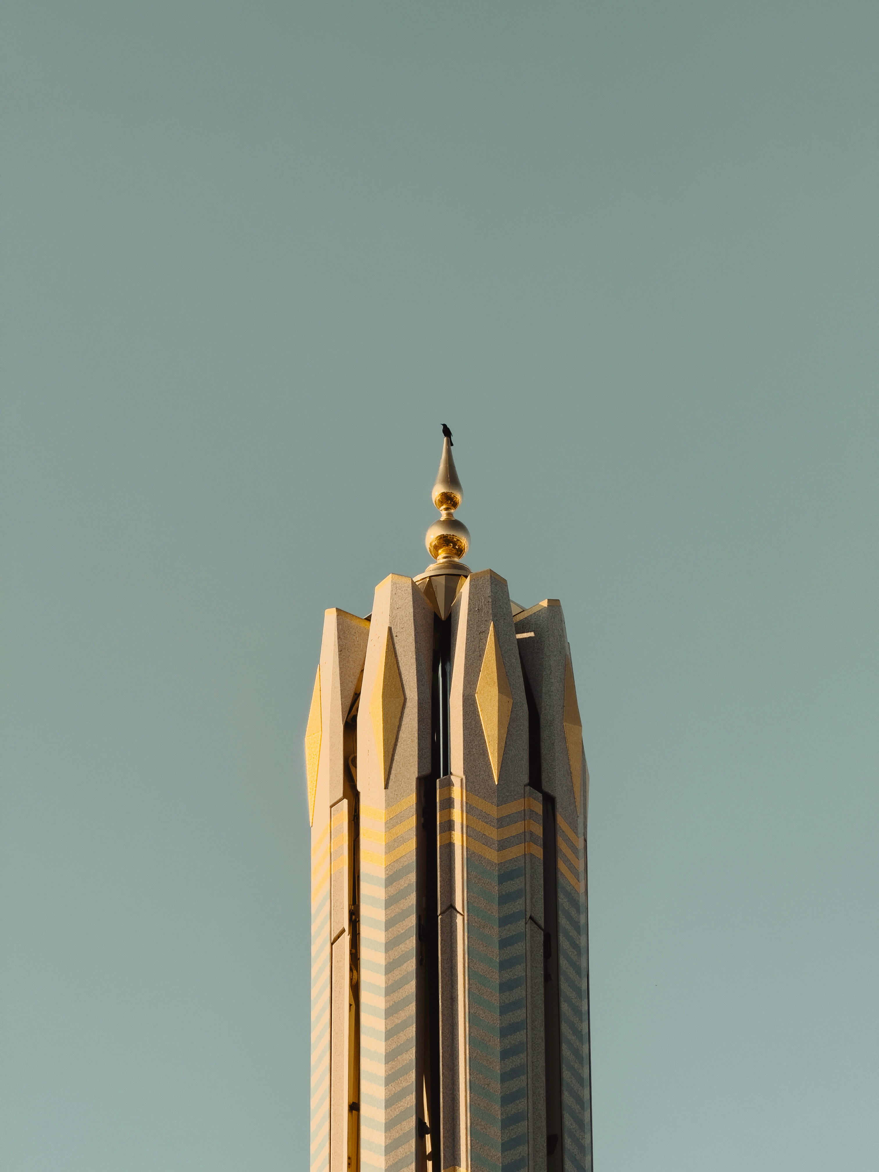 Apex of Geometry: Sunset Light on an Art Deco Spire