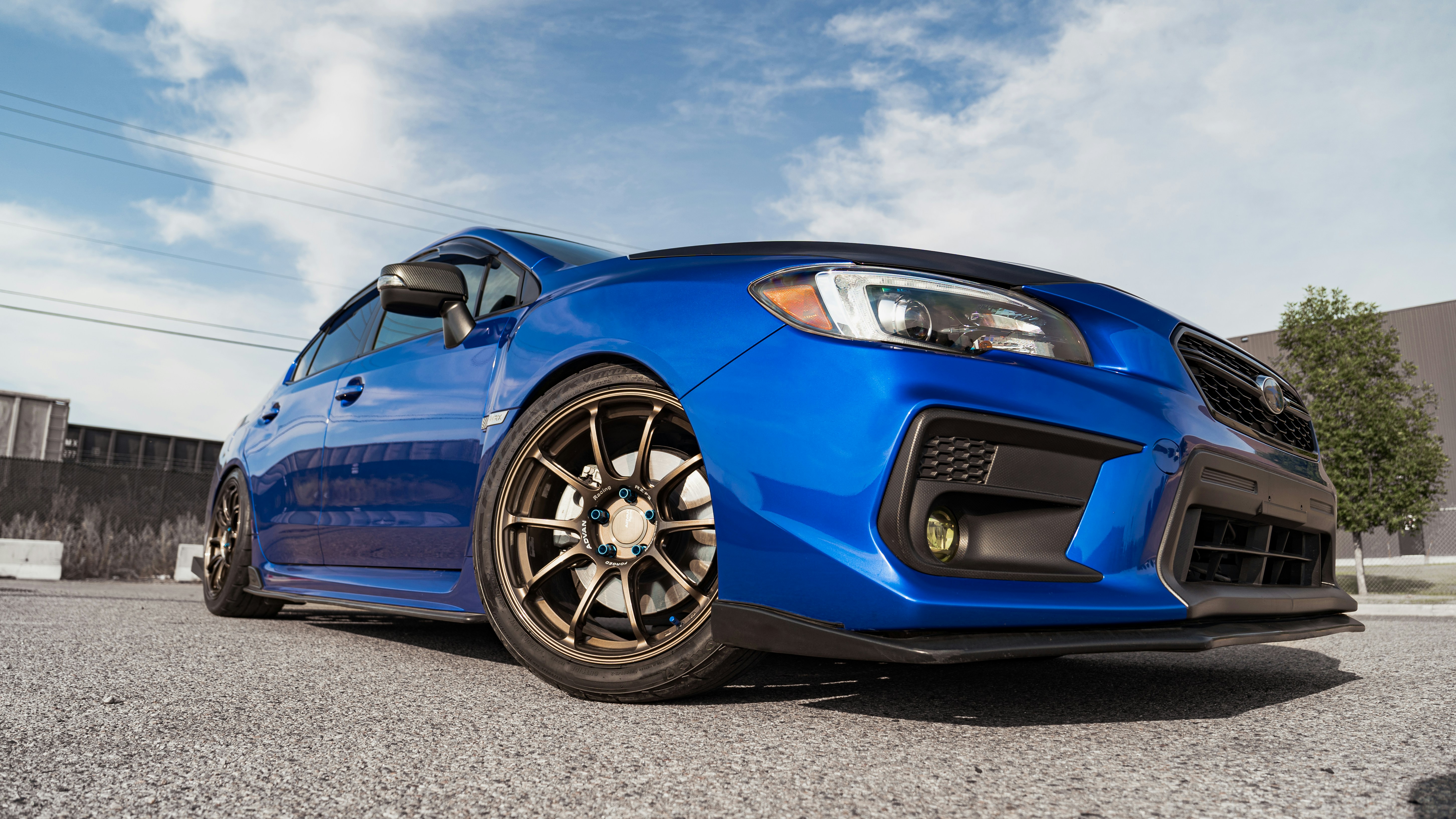 A blue car parked in a parking lot photo – Free Street car Image on ...