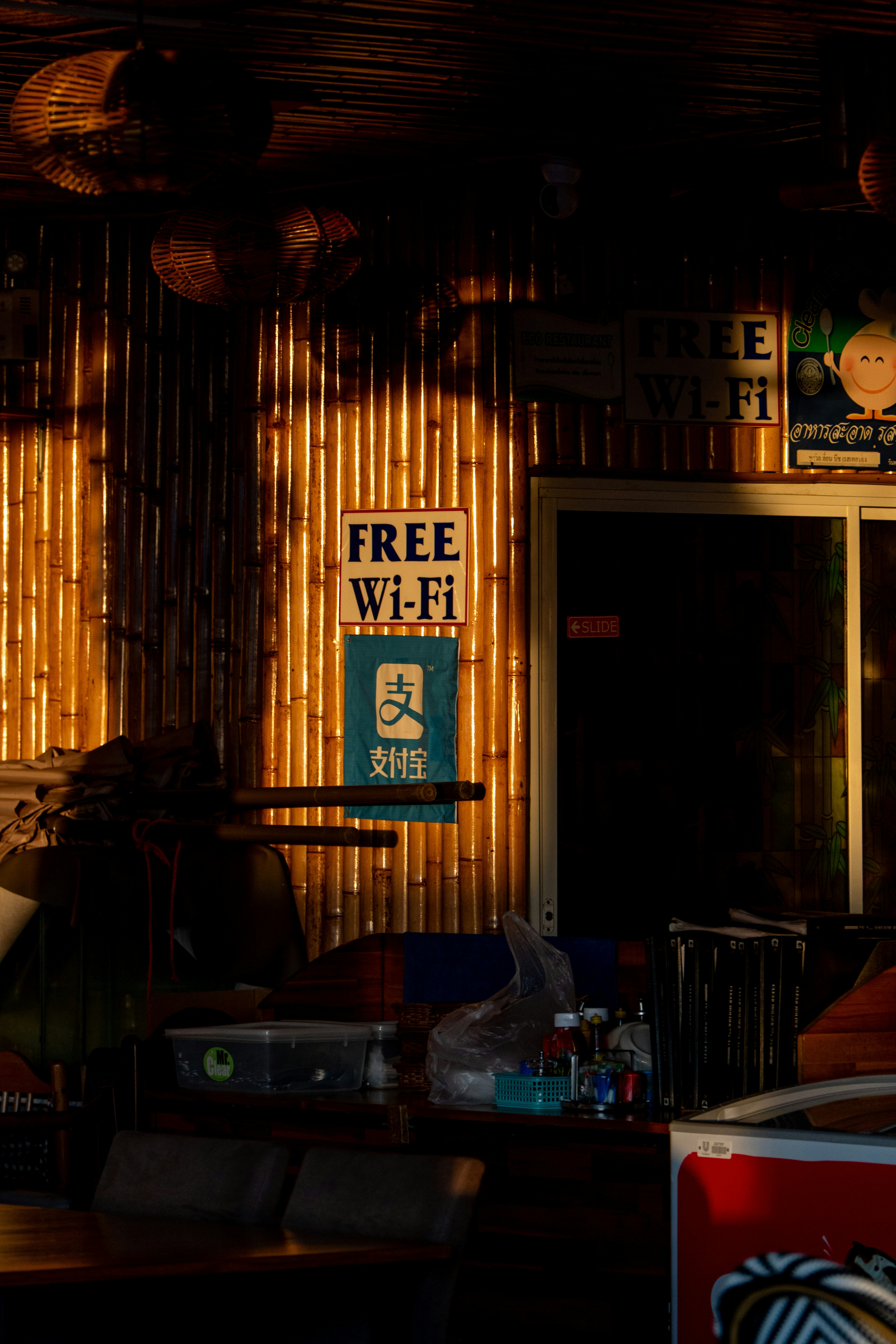Copper Glow Corner: Free Wi-Fi Sign in a Dim Café Nook