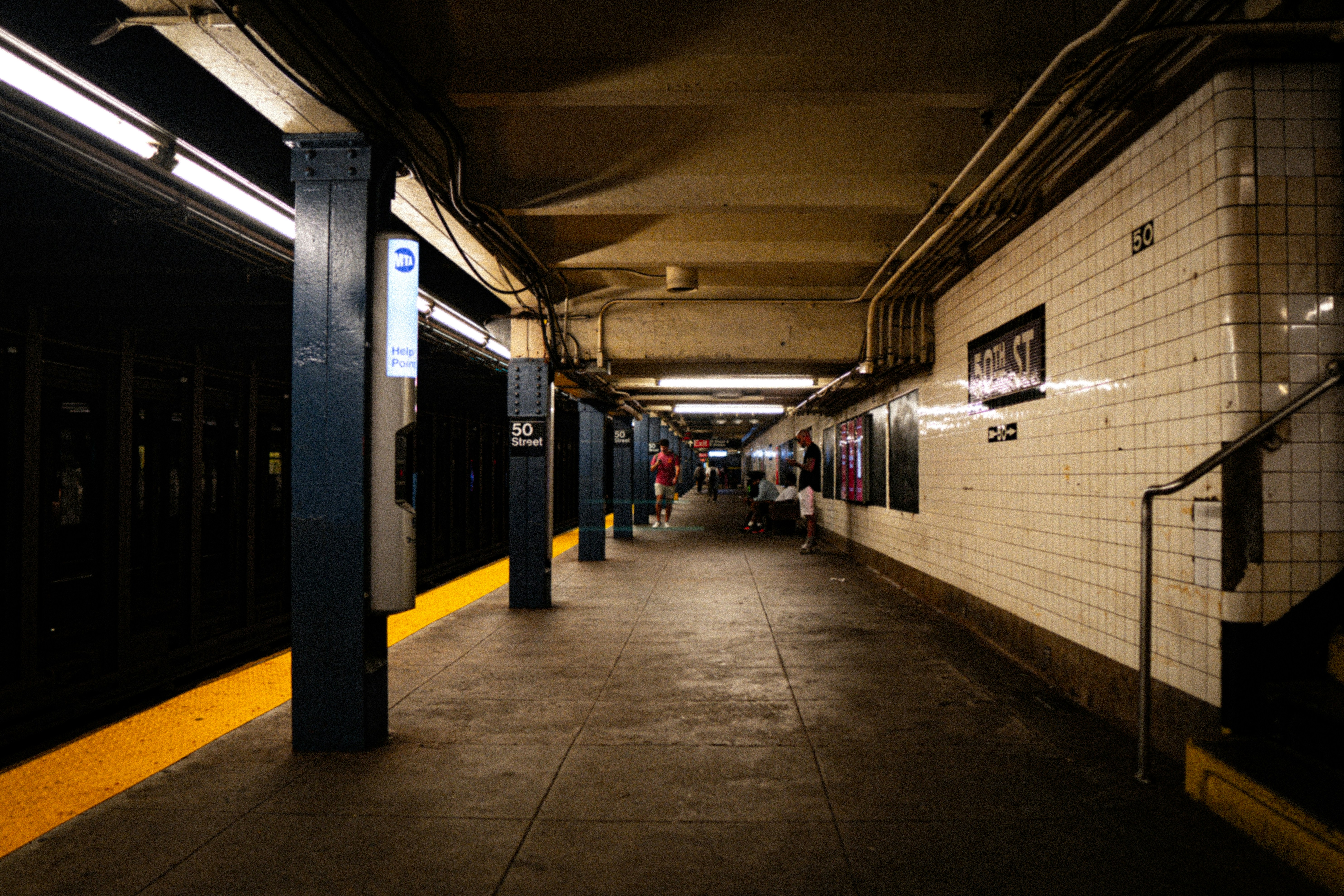 A subway station with a yellow line on the floor photo – Free Nyc Image ...