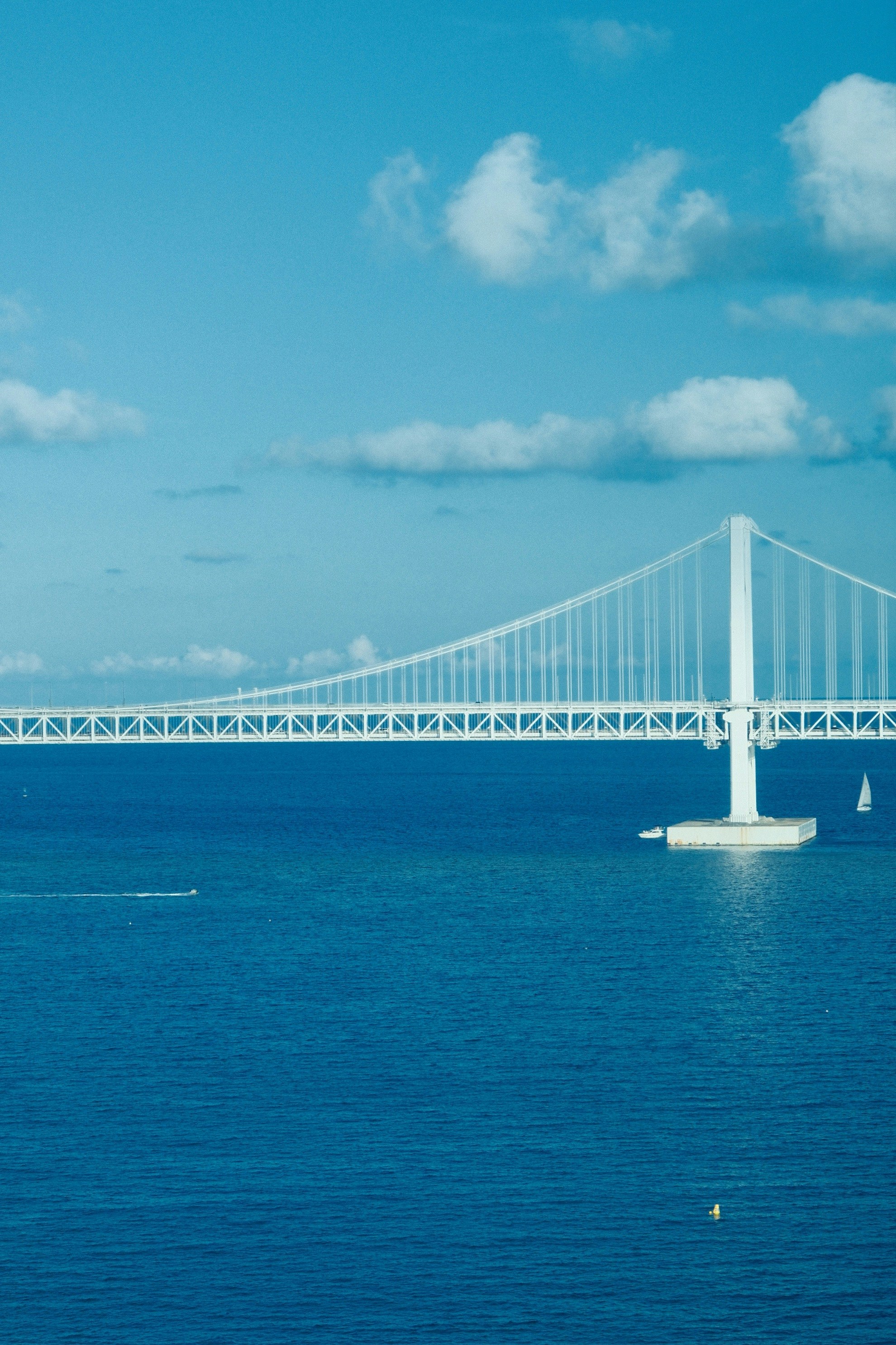 A large bridge over a large body of water photo – Free Blue Image on ...