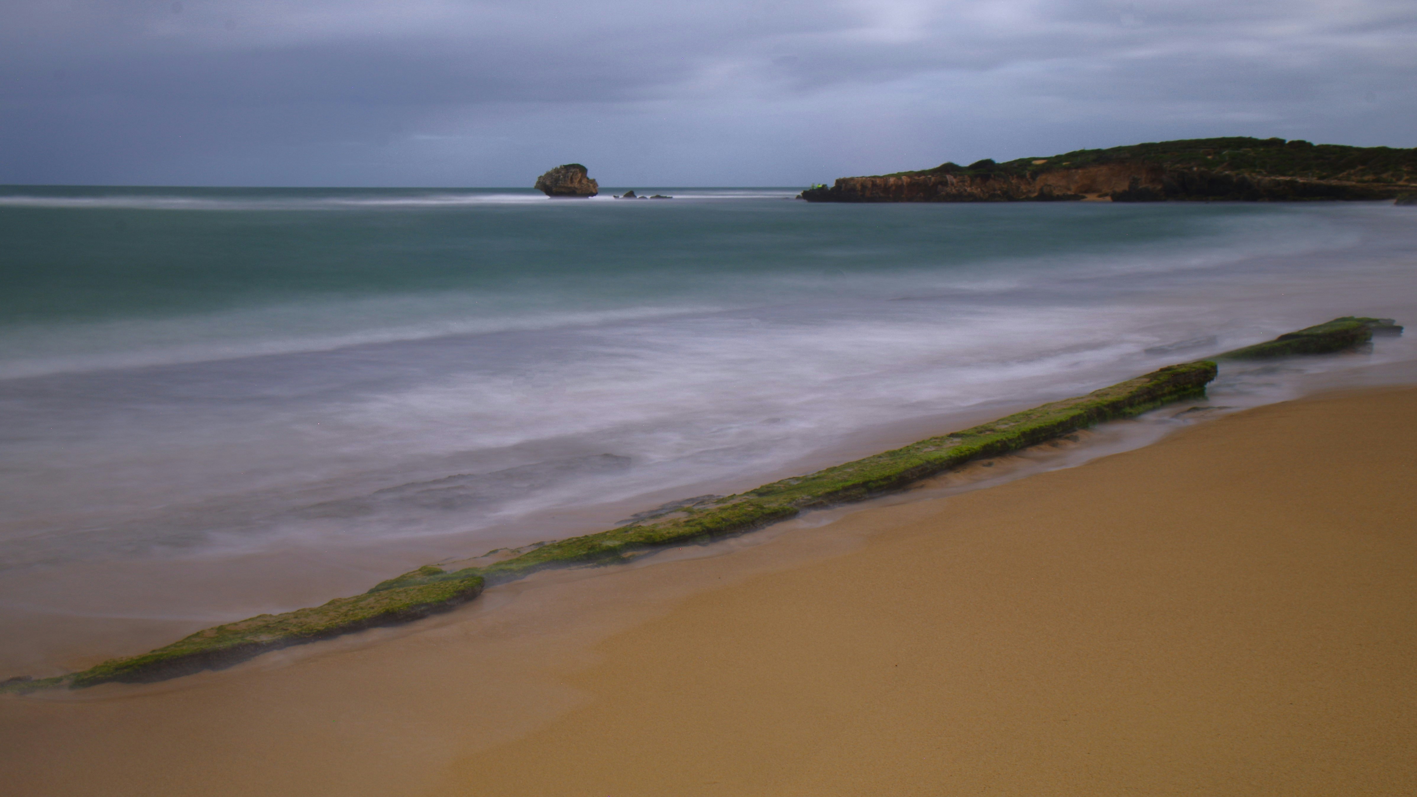 Drifted Tidelines Across a Quiet Coastal Edge