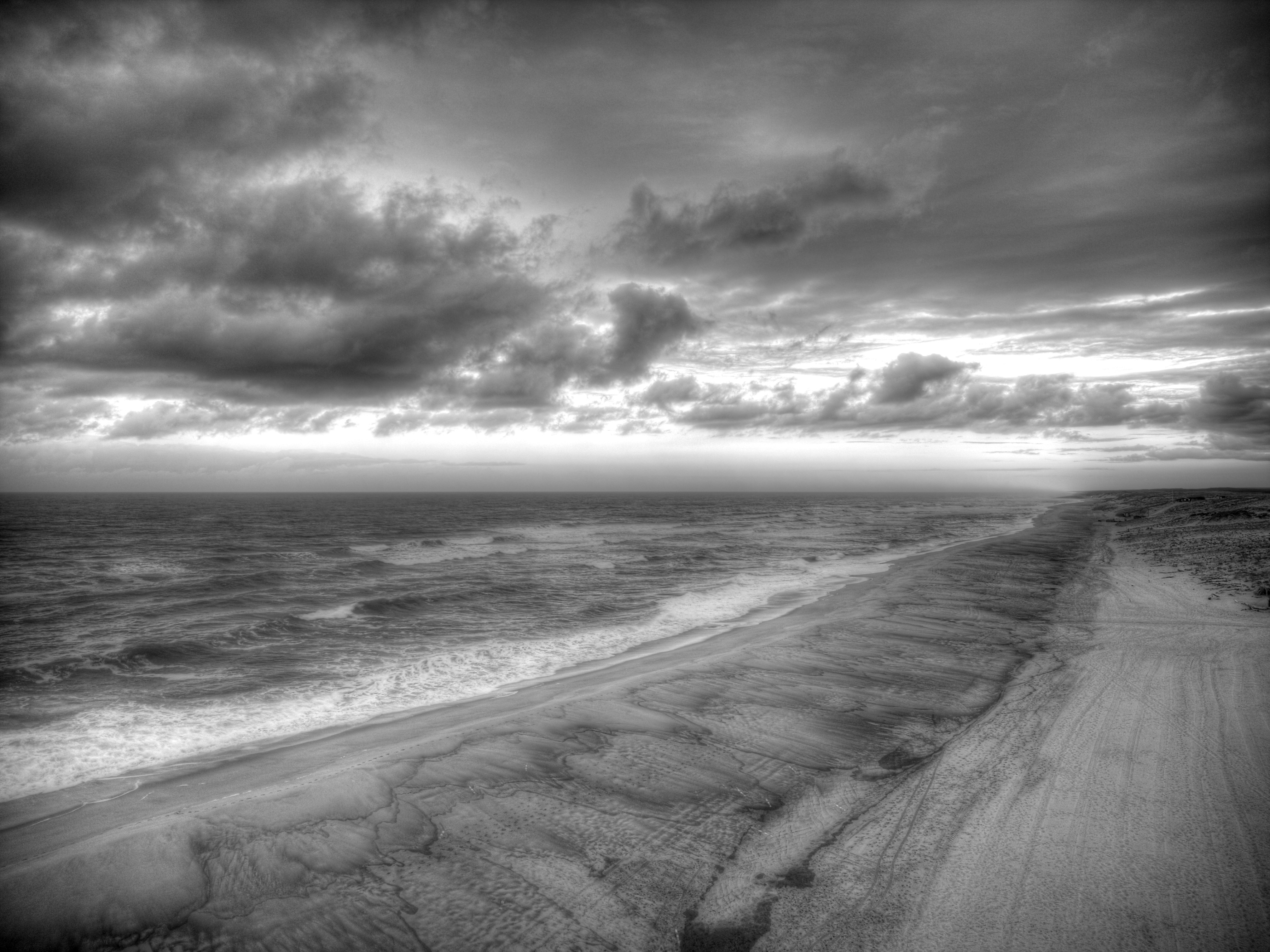 Ribbons of Wet Sand Beneath a Brooding Coastal Sky