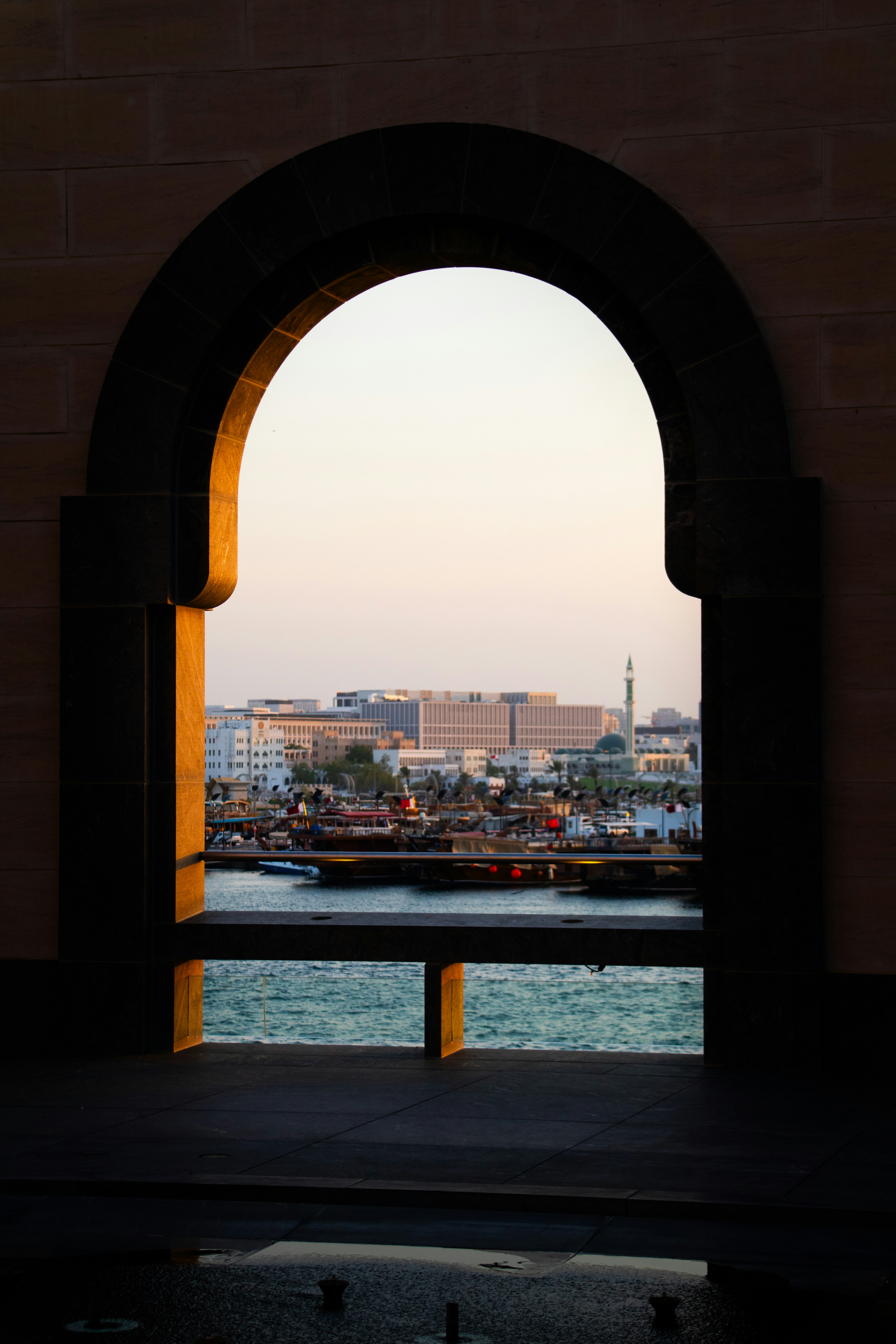 A view of a body of water through an arch photo – Free Building Image ...