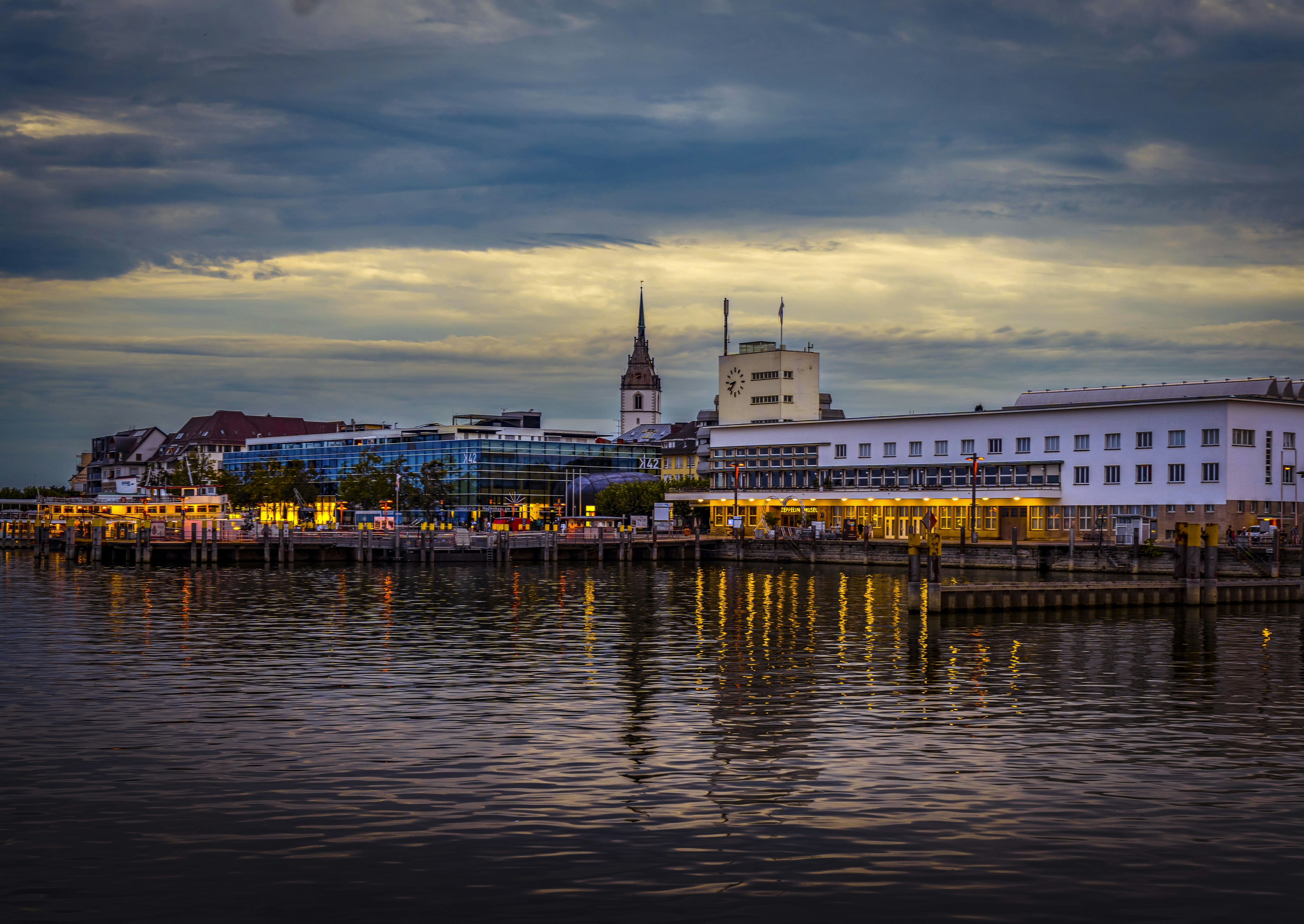Friedrichshafen is located on the shores of Lake Constance, one of the largest lakes in Europe. The lakeside promenade in Friedrichshafen is a popular spot for locals and tourists alike. It is part of the state of Baden-Württemberg and is known for its beautiful lakeside setting, rich history, and significance in aviation and technology.