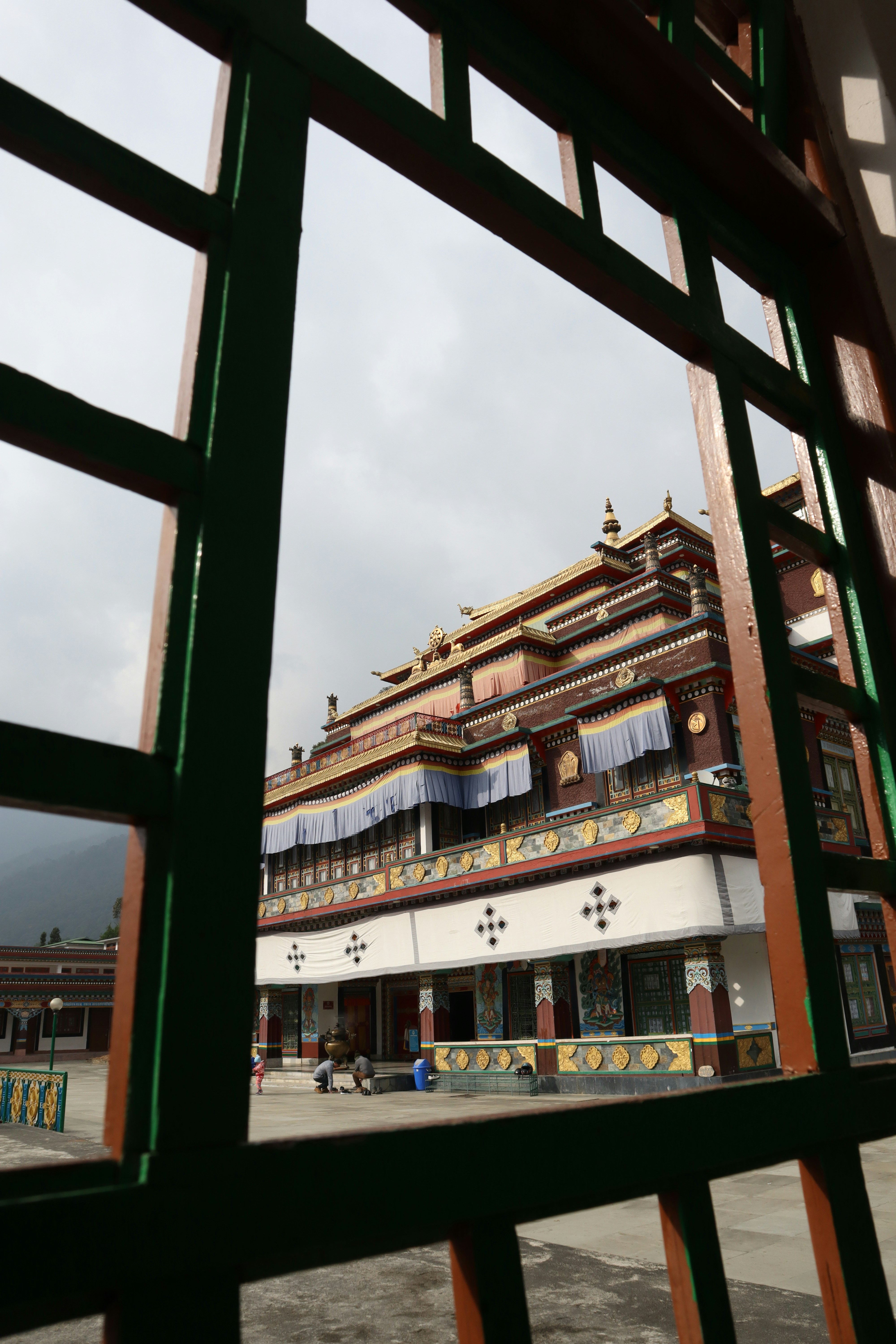 A view of a building through a window photo – Free Composition Image on ...