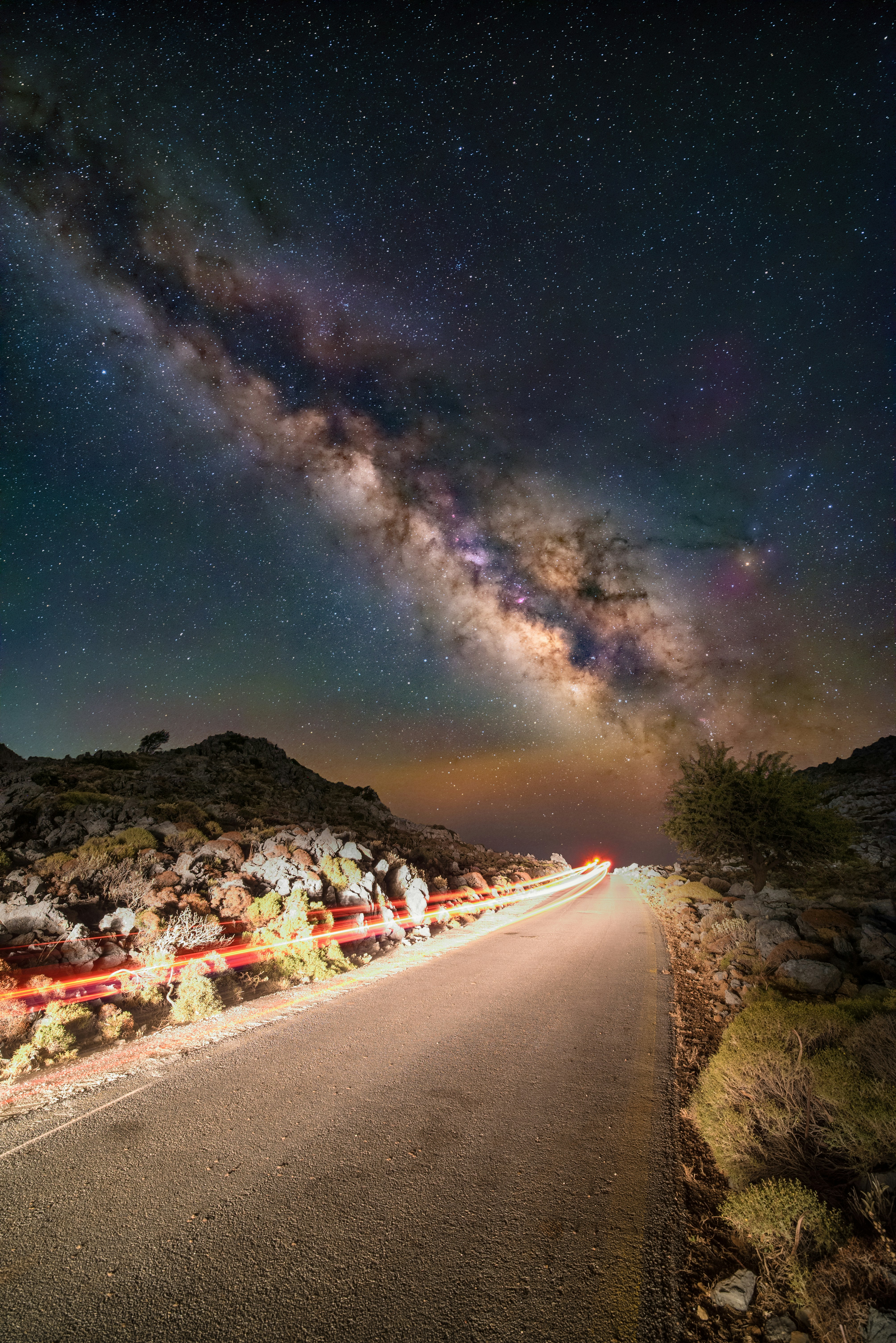 Milky Way Core Over a Rugged Mountain Road at Night