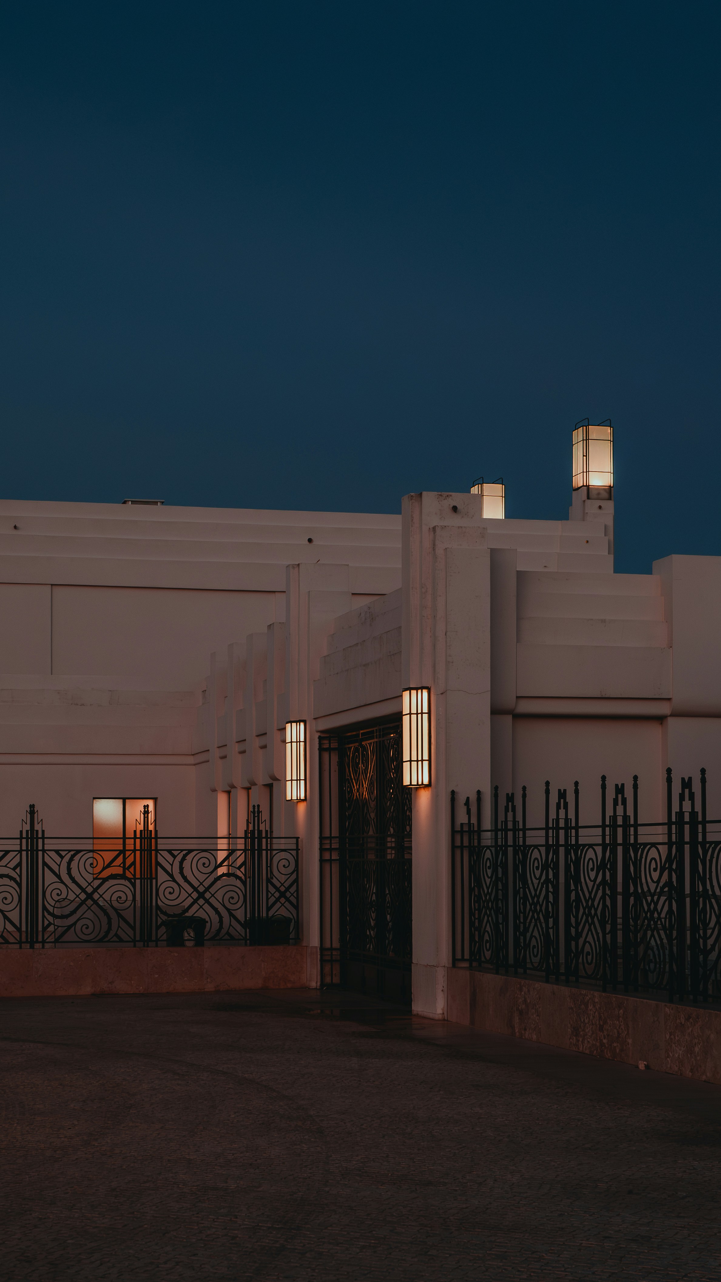 Lantern-lit Threshold of a Modern White Estate