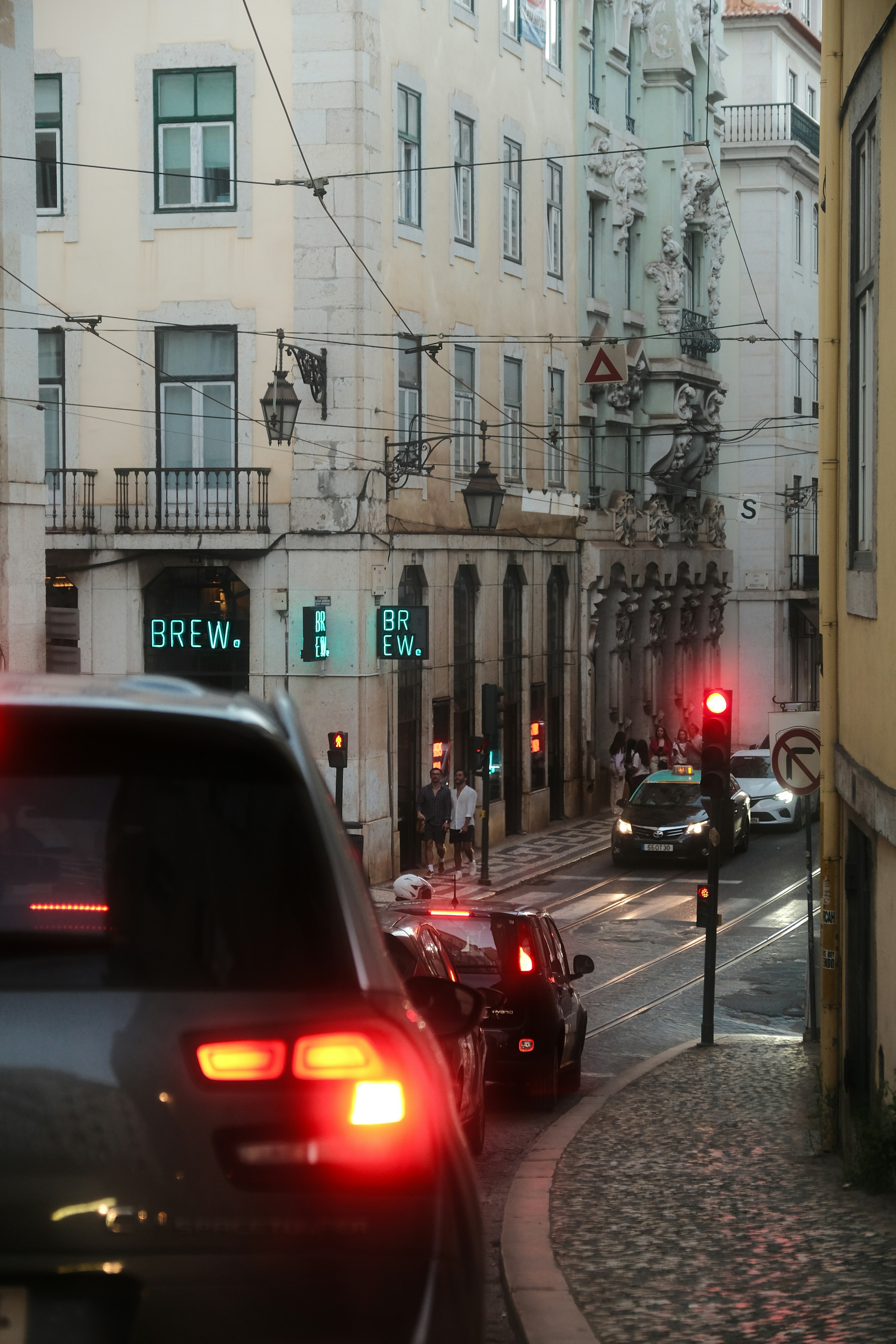Neon Brew on a Cobblestone Street at Dusk, Amid Historic Facades