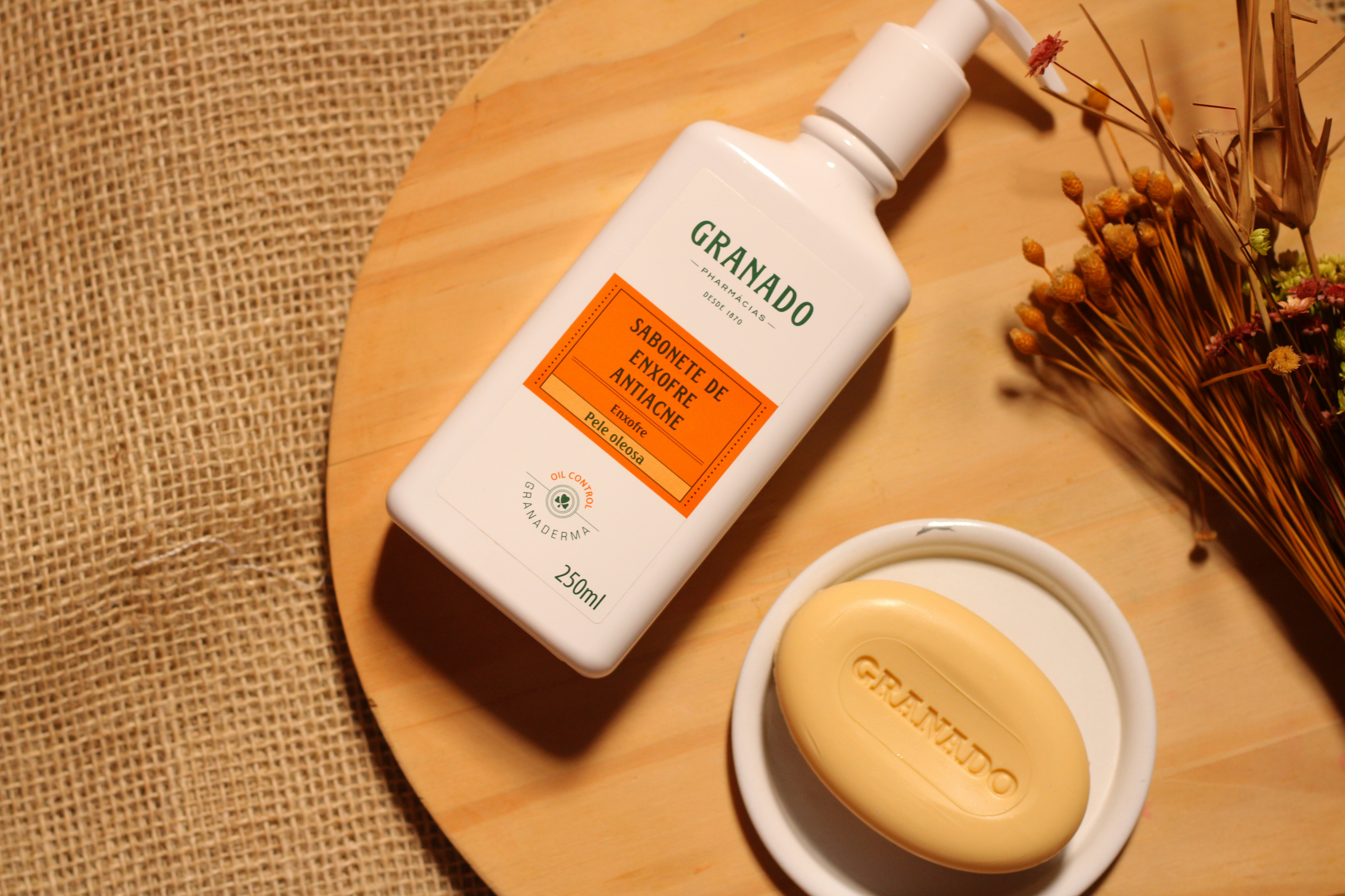 Warm Minimalism: Granado Argan Oil Bottle and Soap on a Round Wood Board