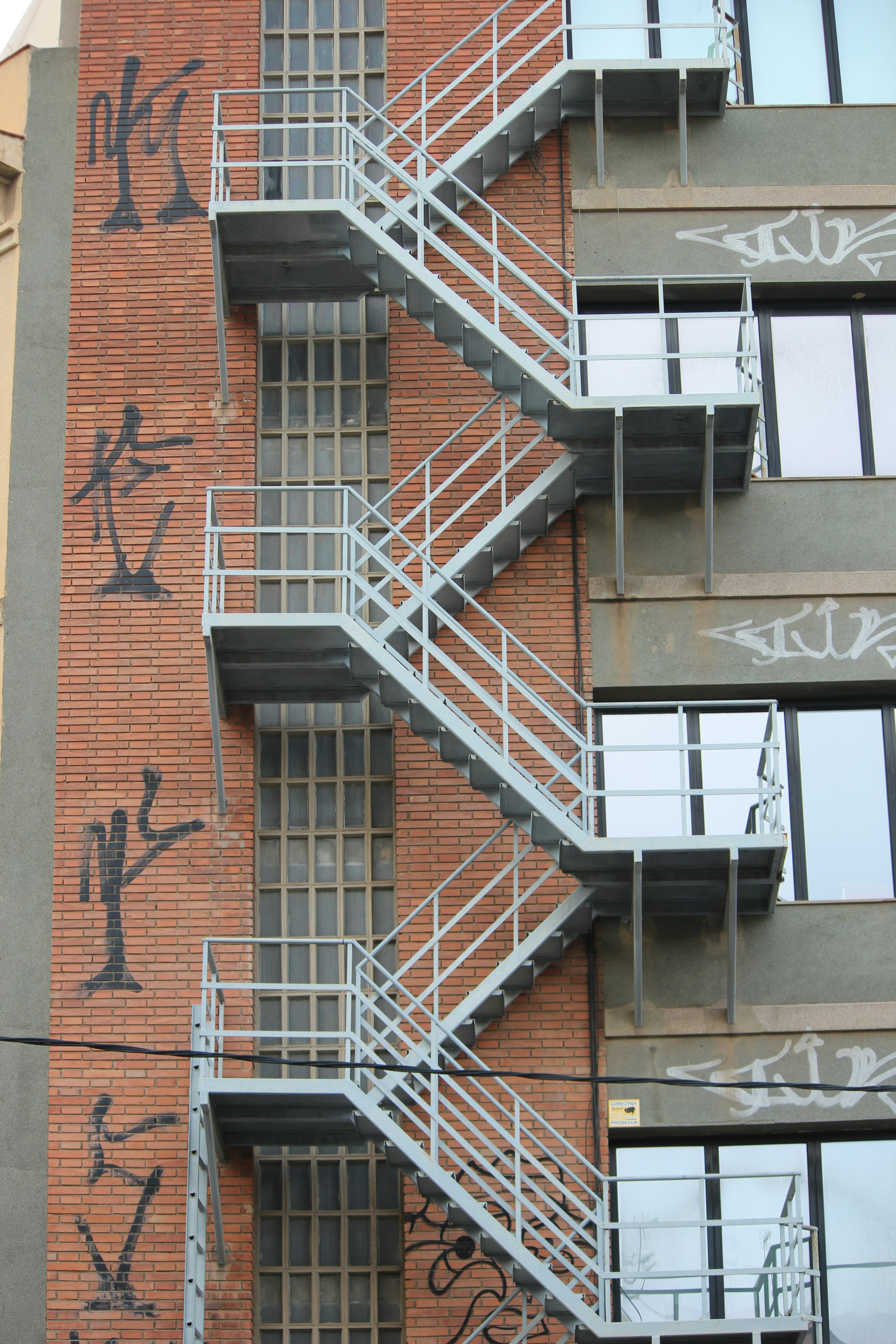 Brick Facade with Layered Fire Escape Cascade
