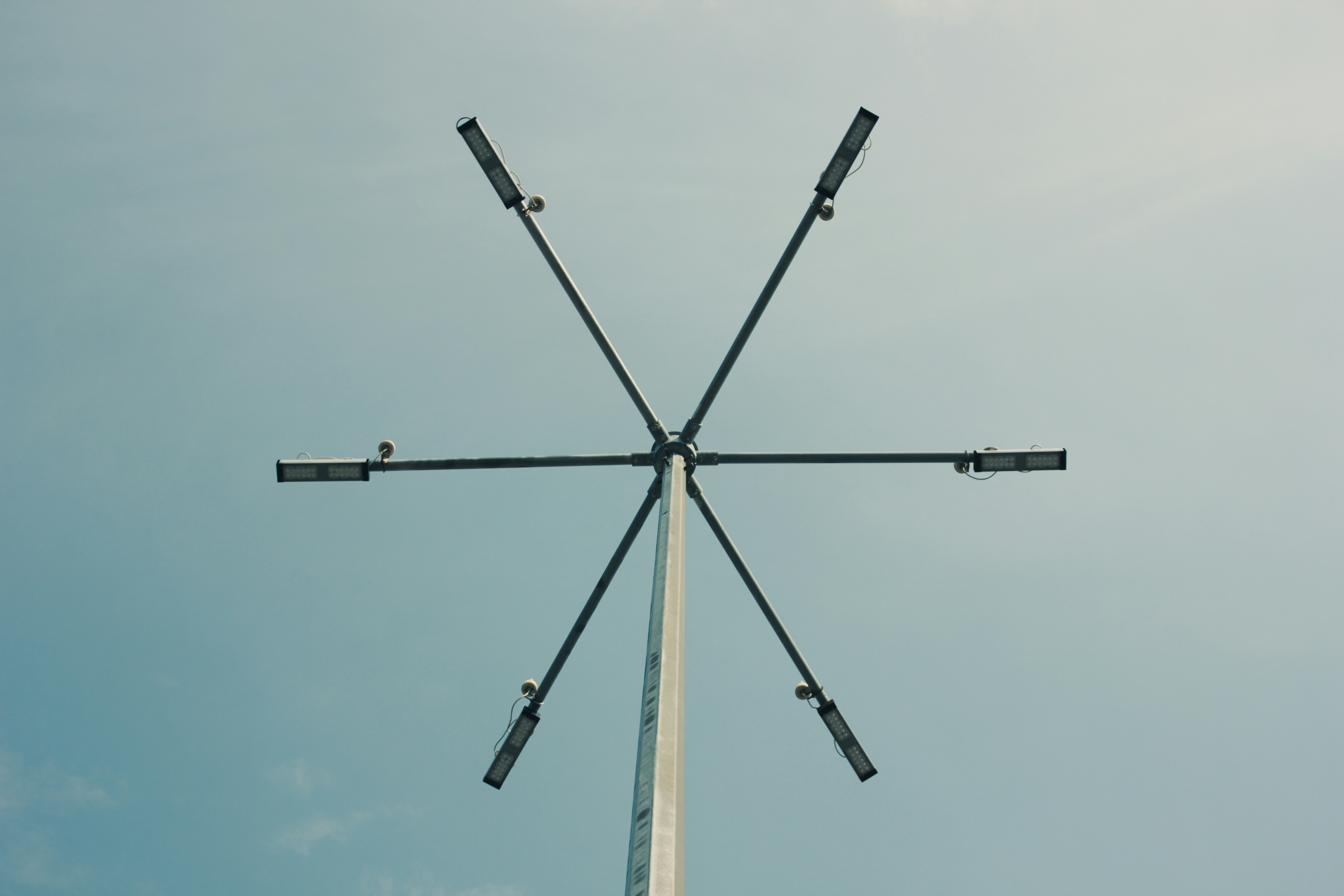A tall pole with four antennas on top of it photo – Free Nature Image ...