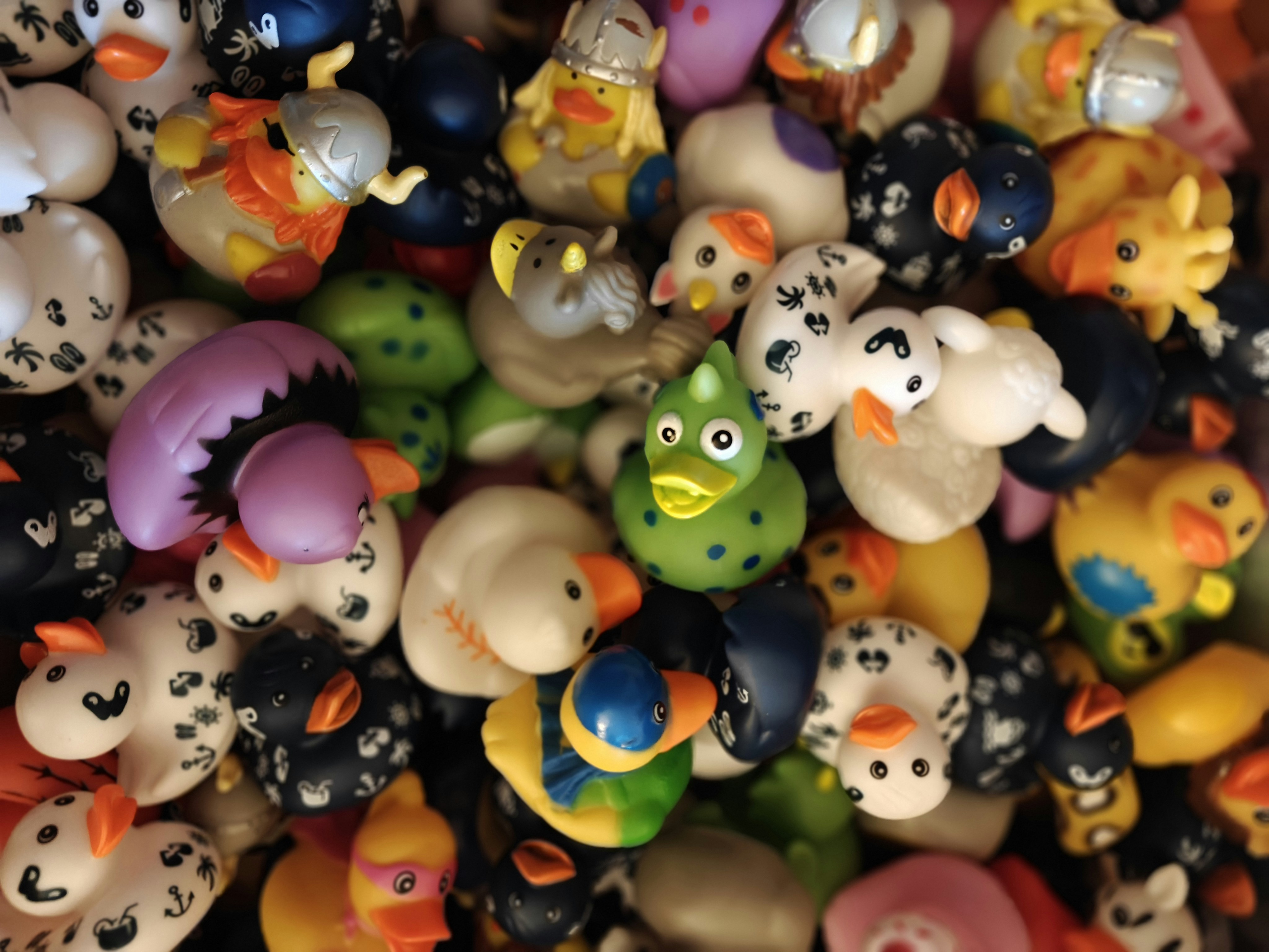 A pile of rubber ducks sitting next to each other photo – Free Ducks ...