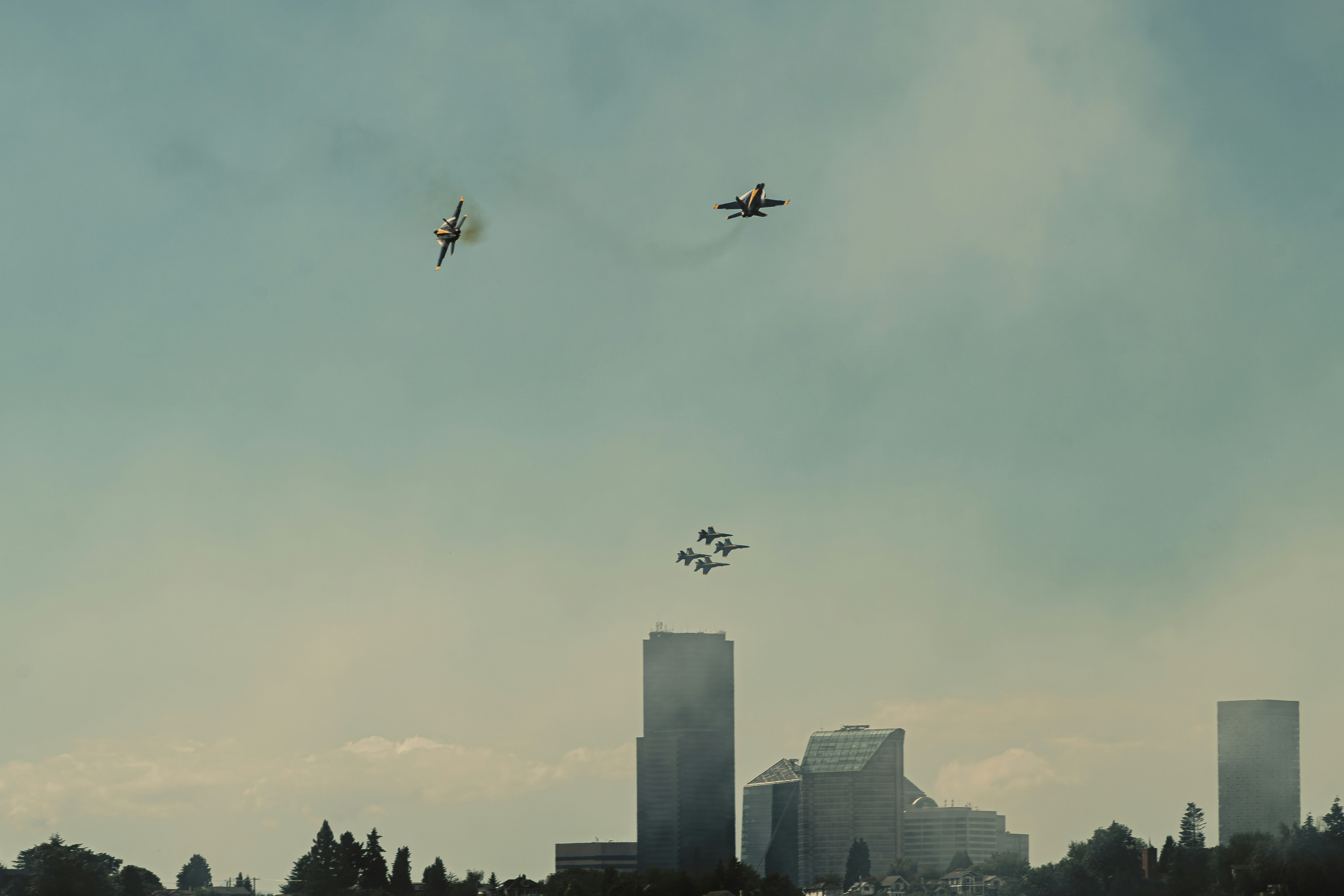 Triad of Jets Over a Quiet City Skyline at Dawn